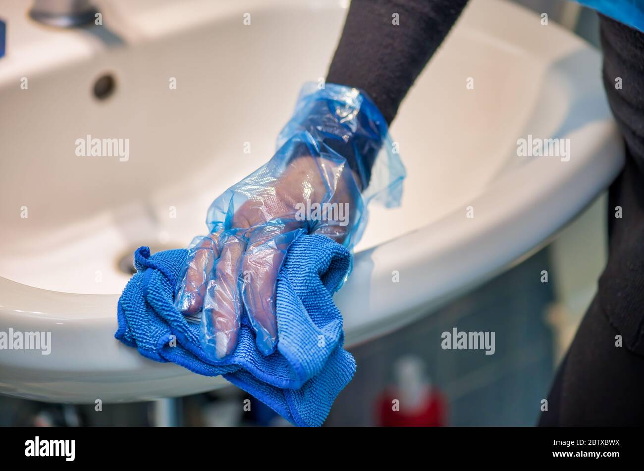Woman hand with glove cleaning bathroom, disinfecting room Stock Photo ...