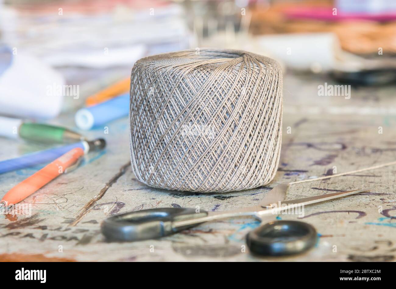 Grey color ball of threads wool in a sewing laboratory Stock Photo - Alamy