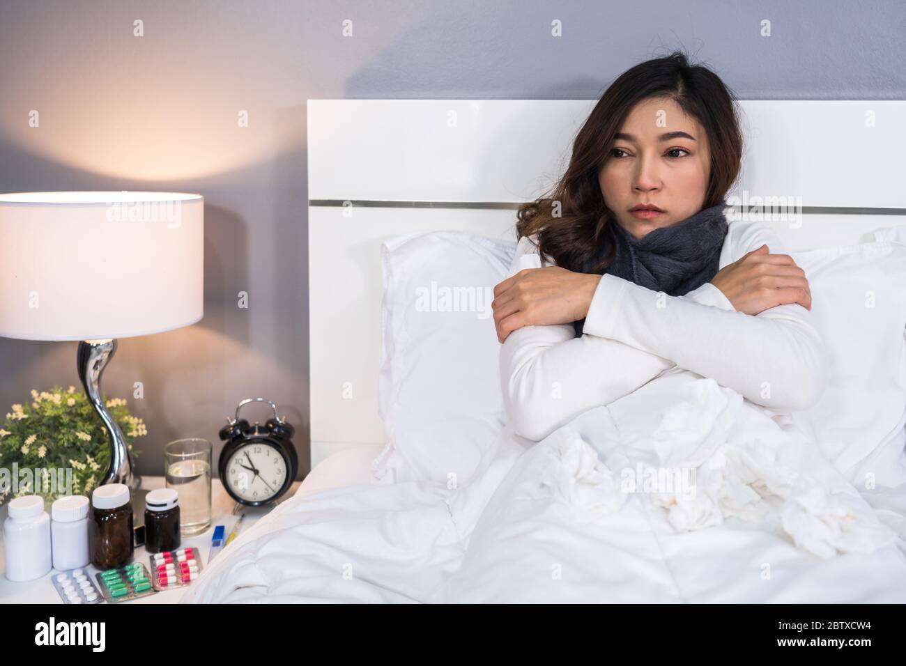 sick woman feeling cold in a bed Stock Photo - Alamy