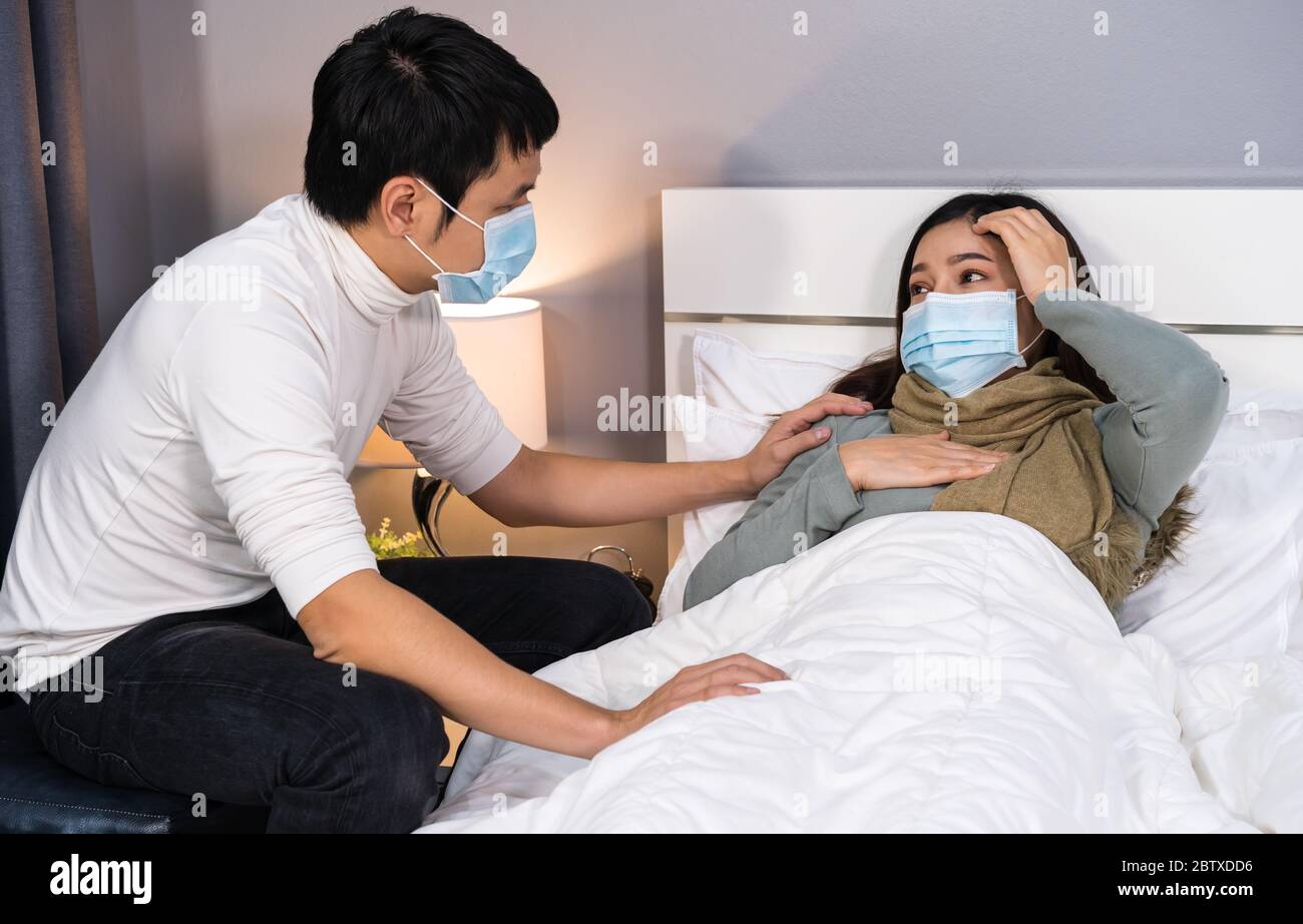 husband take care his sick wife on a bed at home, people must be ...
