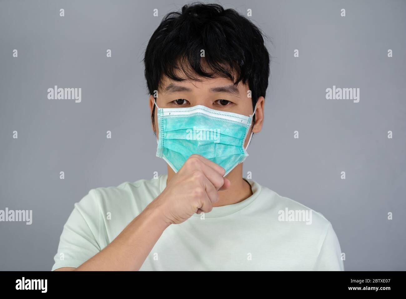 Japanese man wearing surgical mask hi-res stock photography and images ...