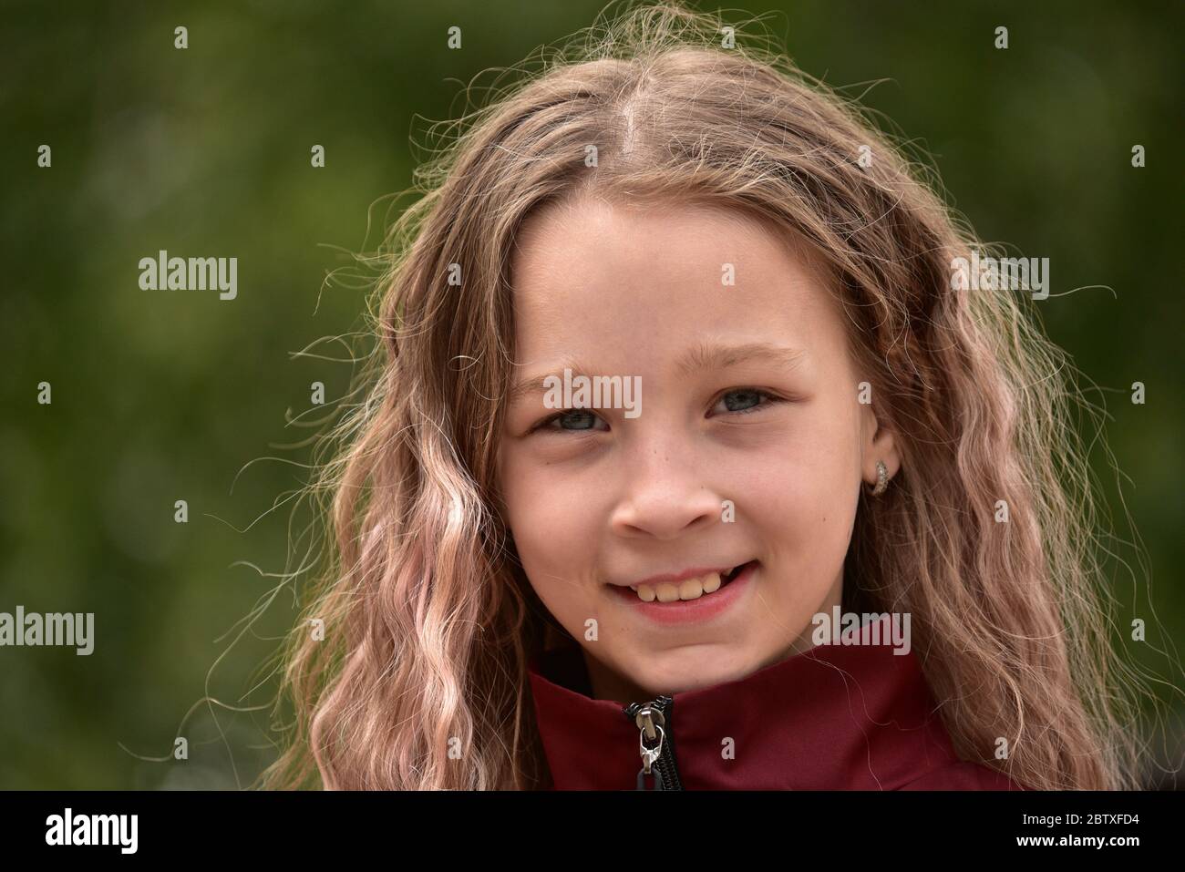 Smile, joy. Girl 9 years old on the street. Portrait of a girl of 9 or ...