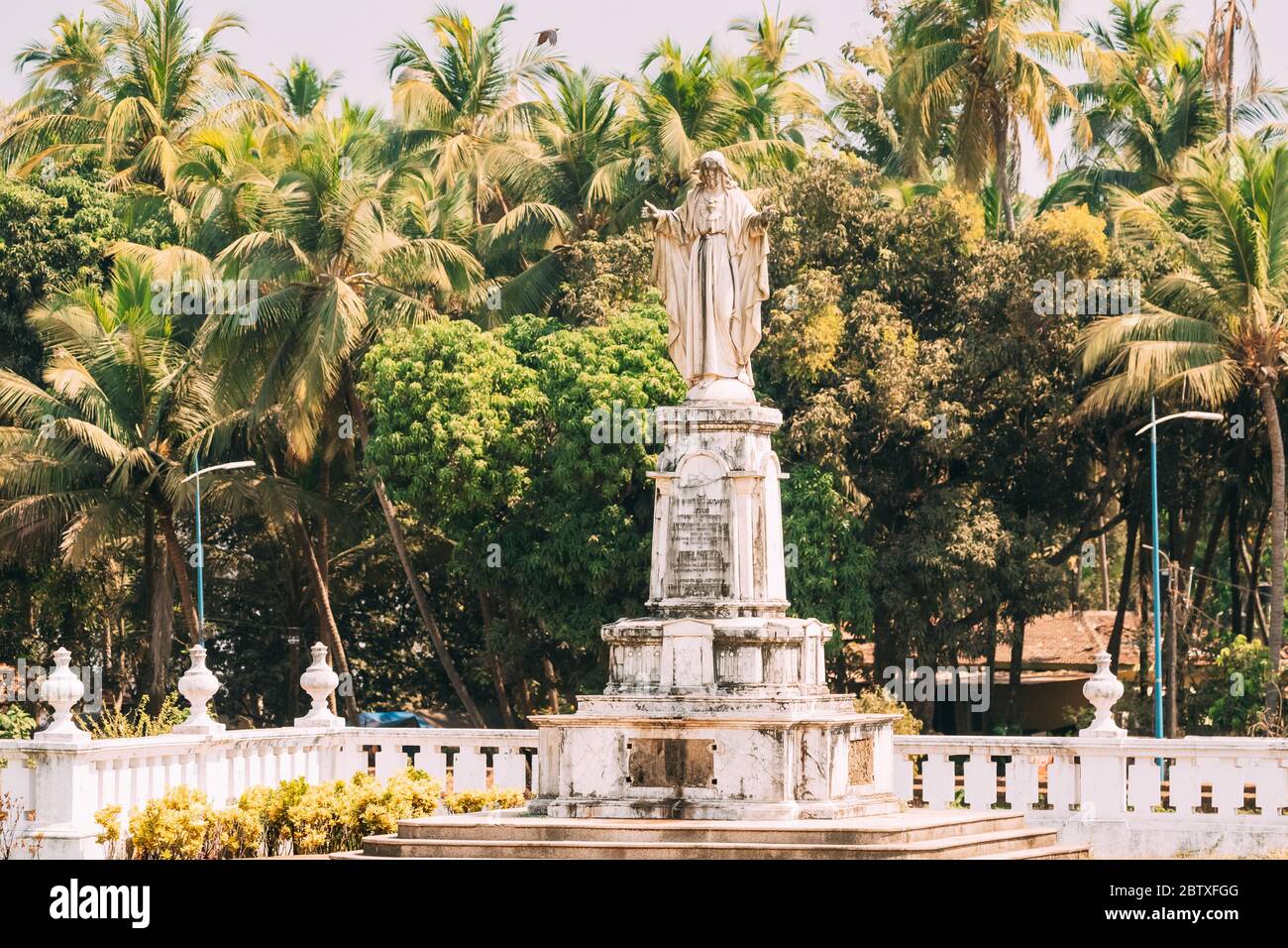 Old Goa, India. Cathedral Of St. Paul And Statue Of Jesus In Sunny Day ...