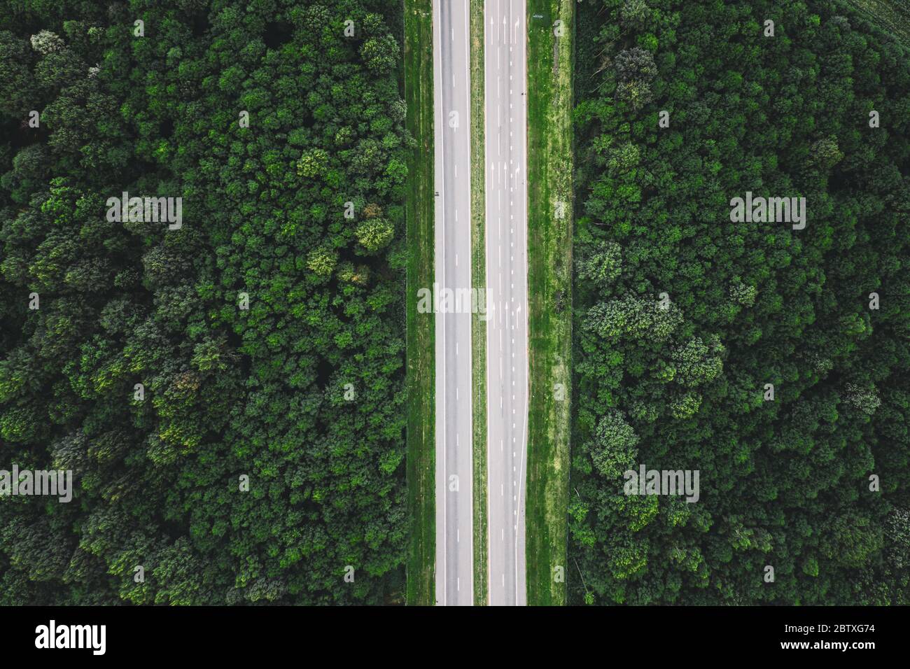 Aerial View Of Highway Road Through Green Forest Landscape In Summer ...