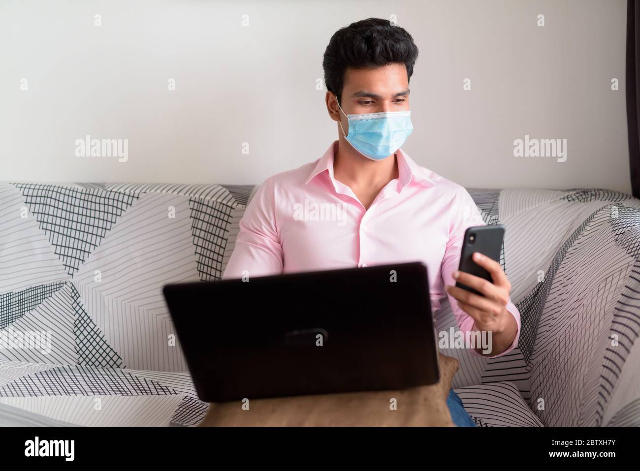 Indian work from home phone laptop hi-res stock photography and images ...