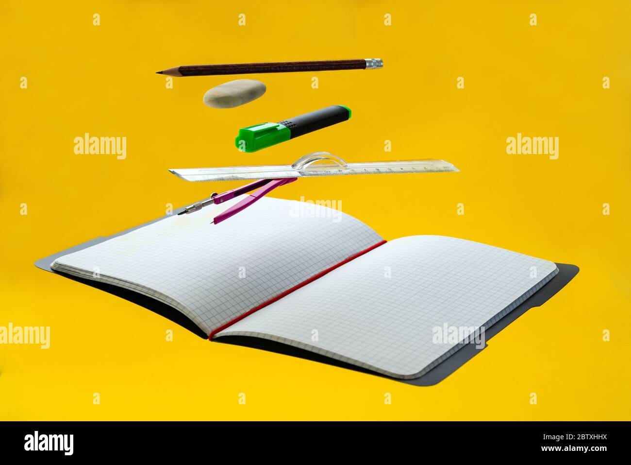 Levitating school supplies for math - notebook, pen, ruler, pencil ...