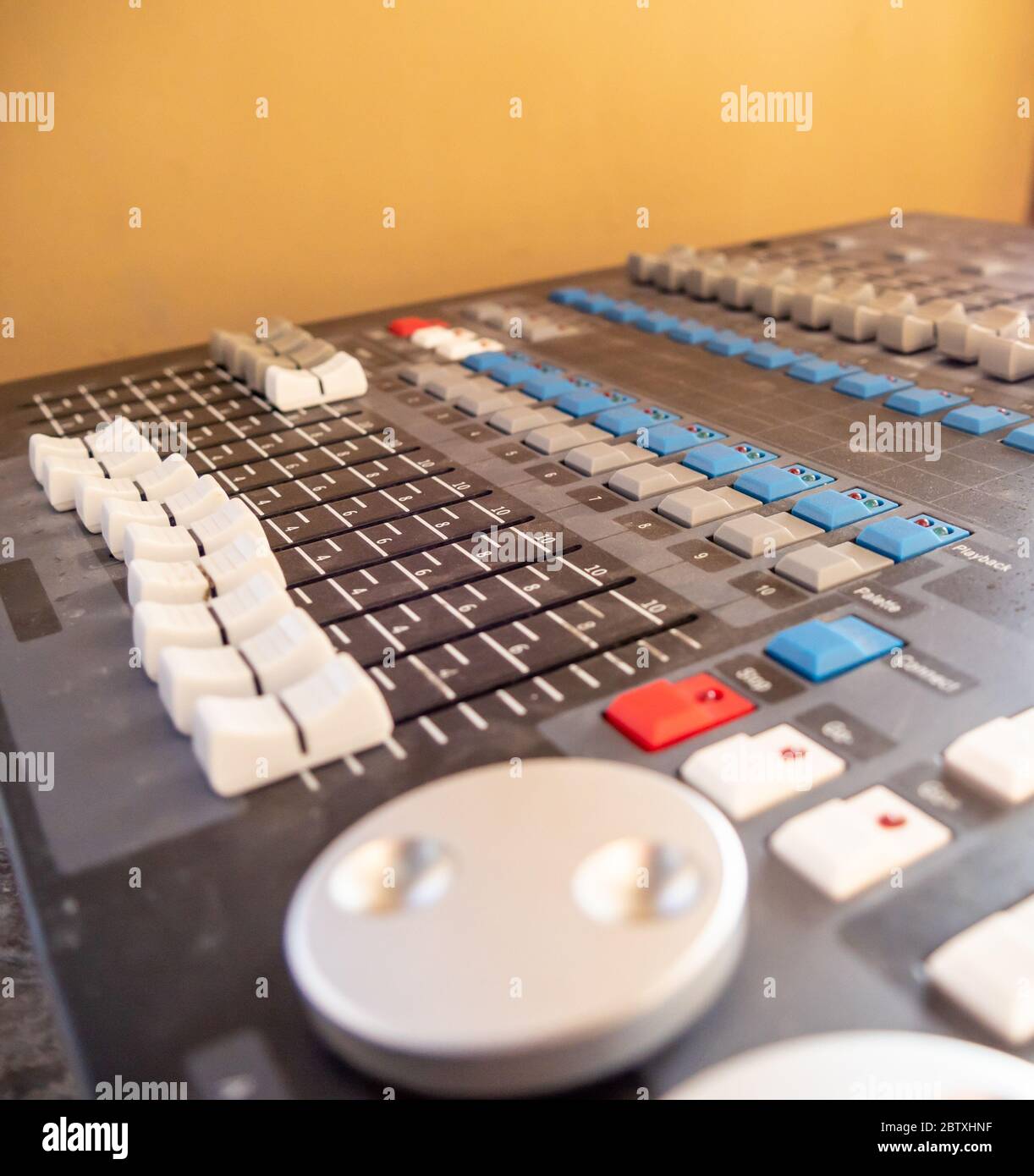 Sound mixer control panel with sliders and buttons closeup view ...
