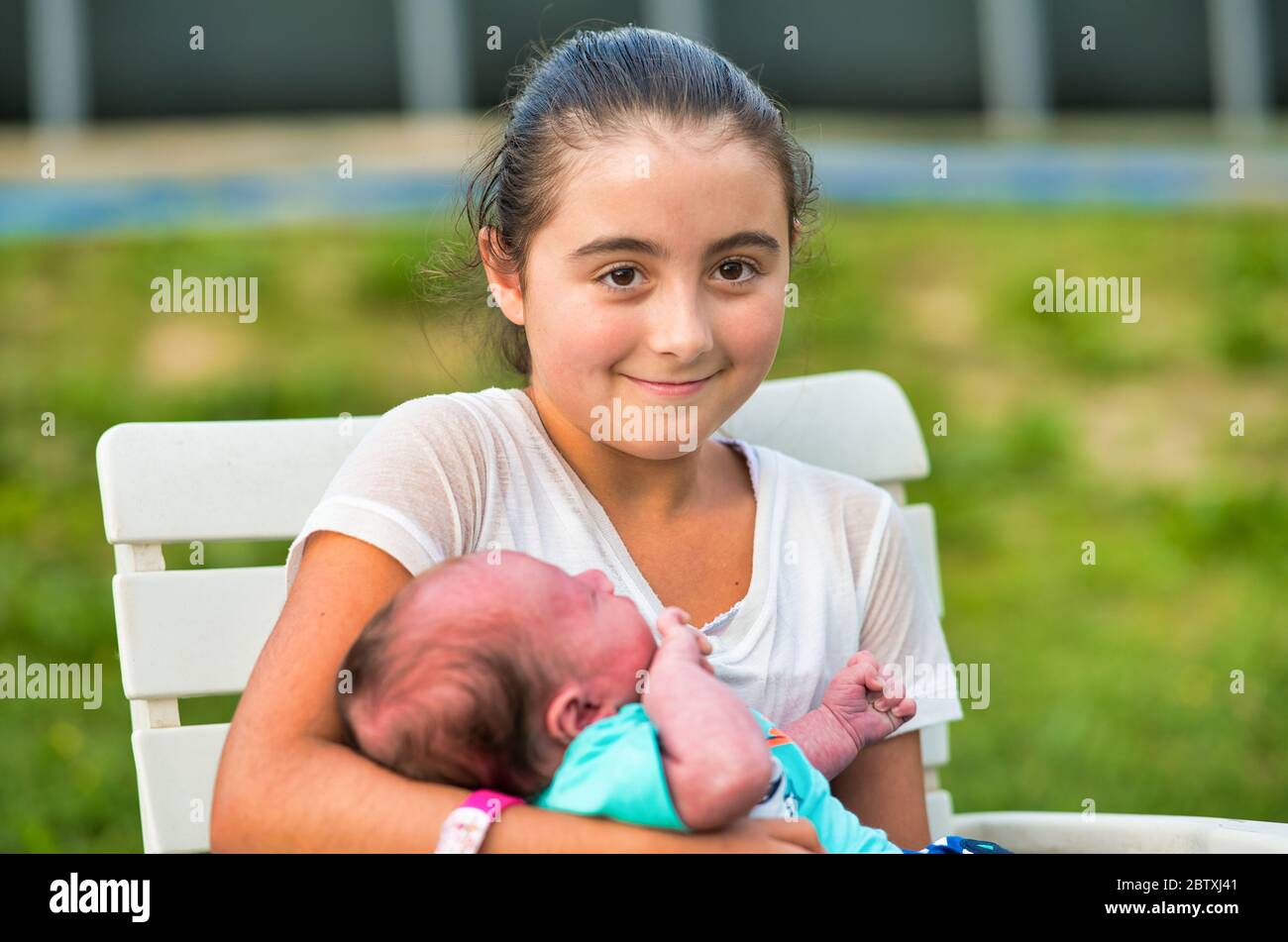 Child taking care of sibling hi-res stock photography and images - Alamy