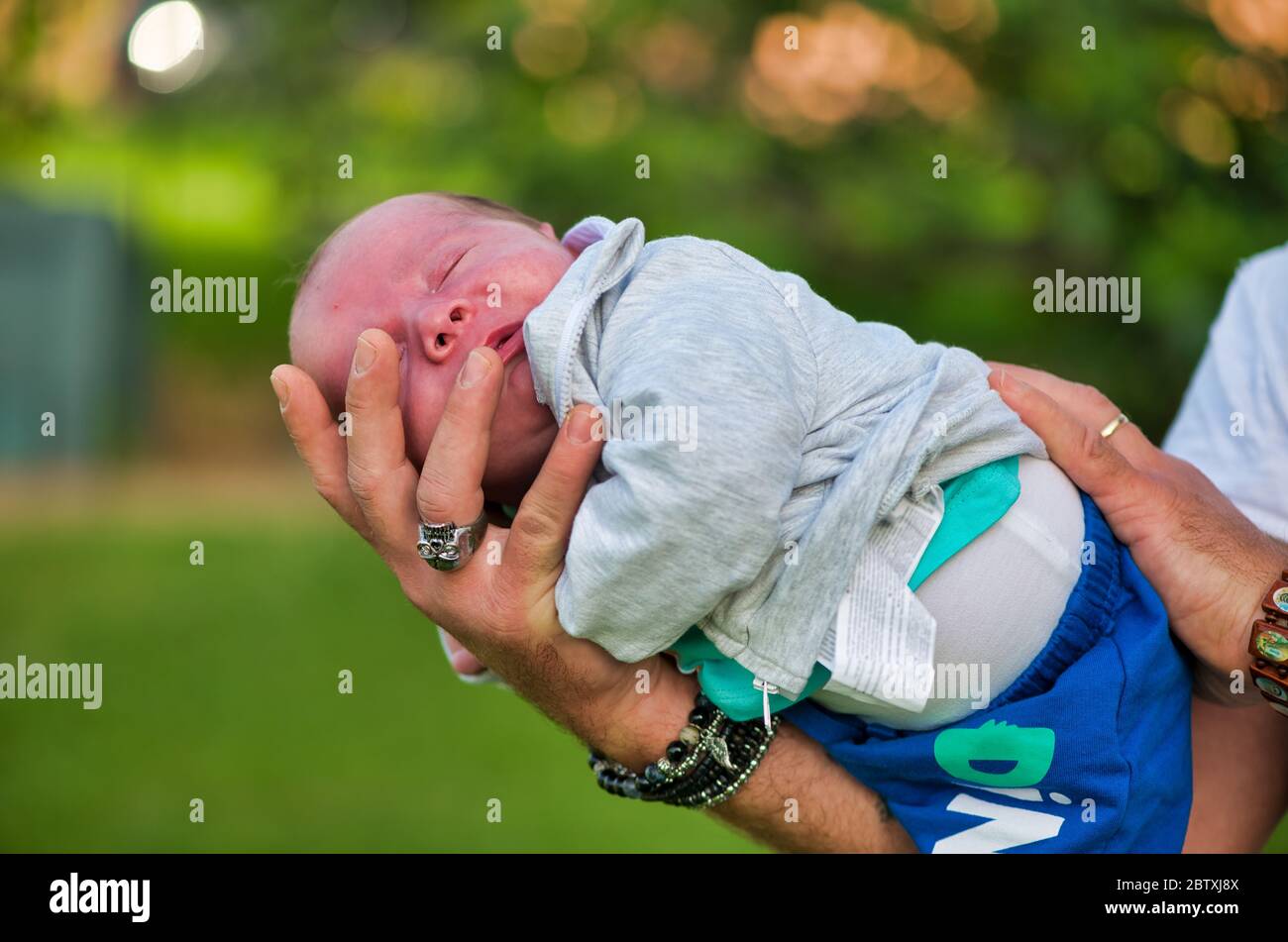 Mans child holding hand hi-res stock photography and images - Alamy