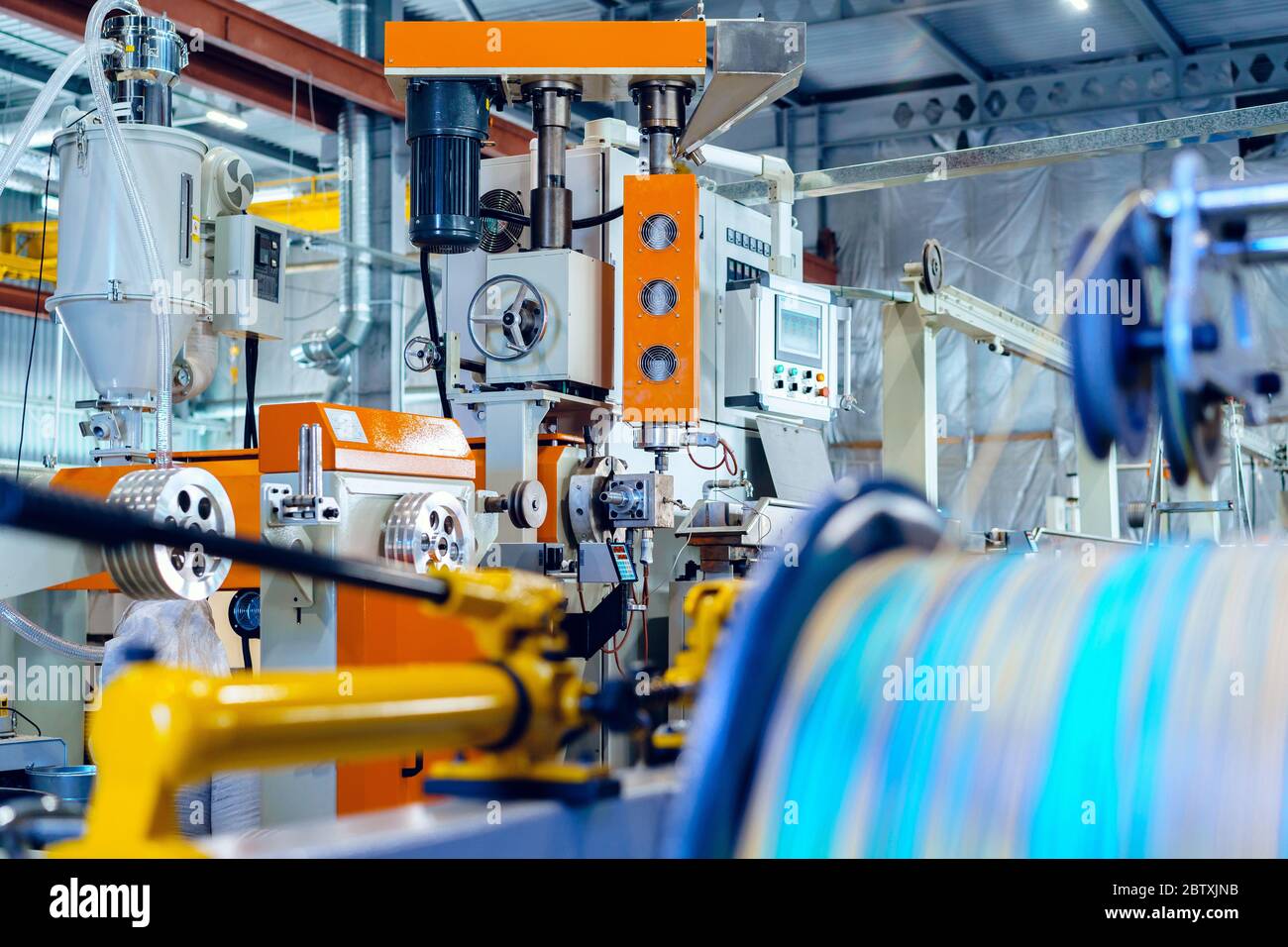 Cable production in process. Cable factory close up Stock Photo - Alamy