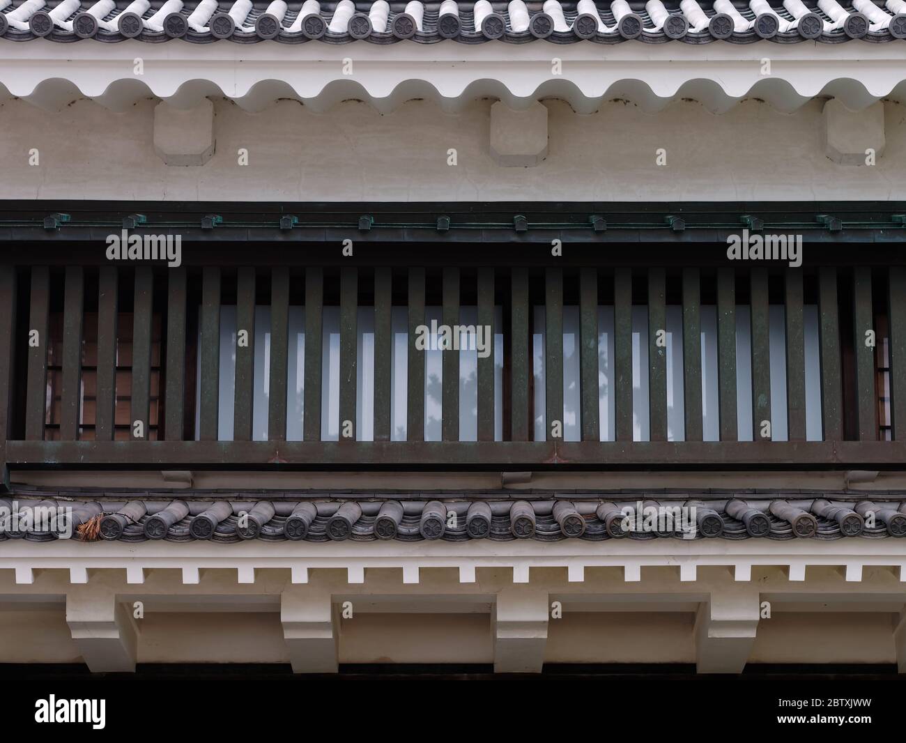 Close-up of exterior of the Odawara Castle. Roof tiles with the emblem ...