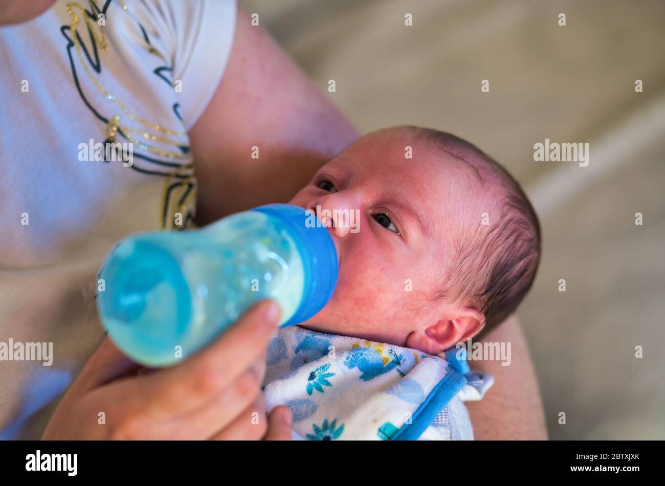 Giving food to young baby hi-res stock photography and images - Alamy
