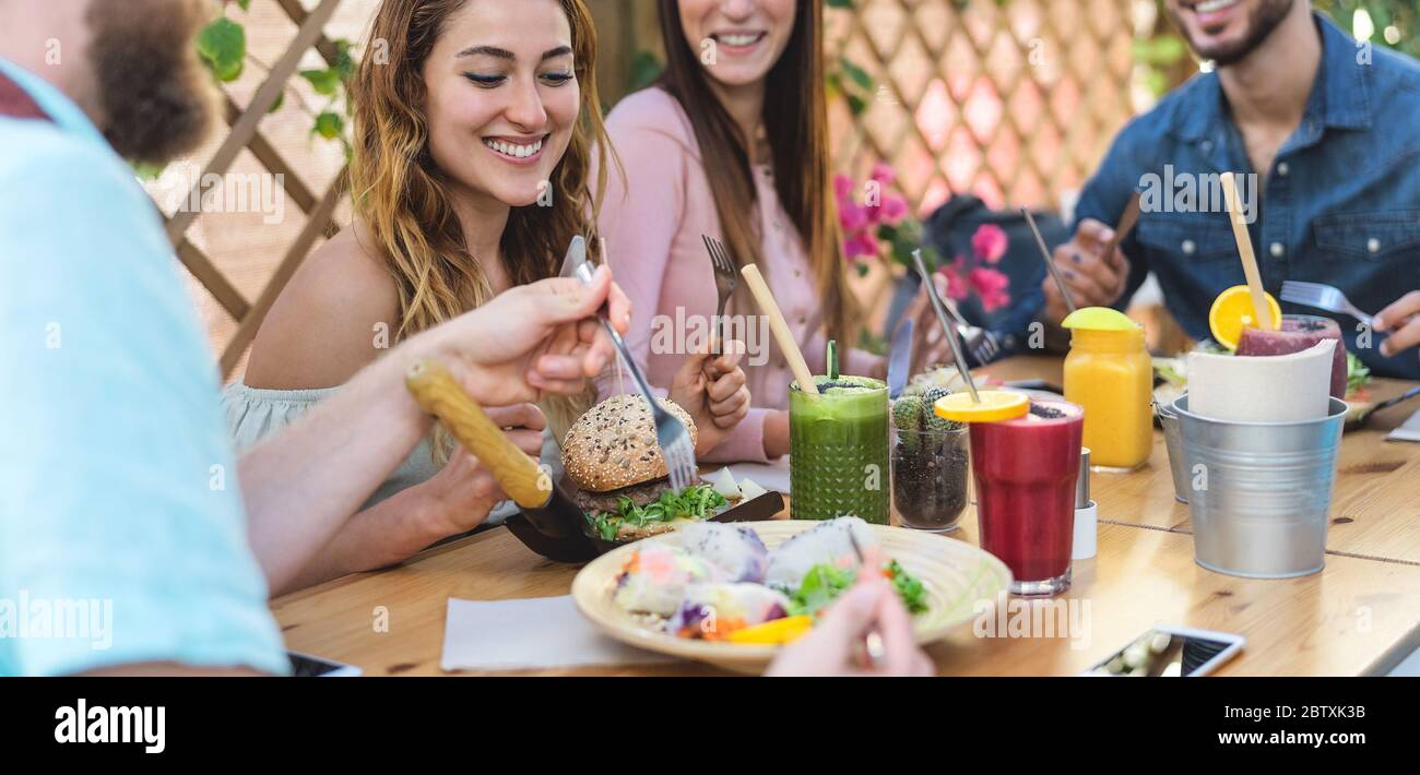 Happy friends lunching with healthy food in bar coffee brunch - Young ...