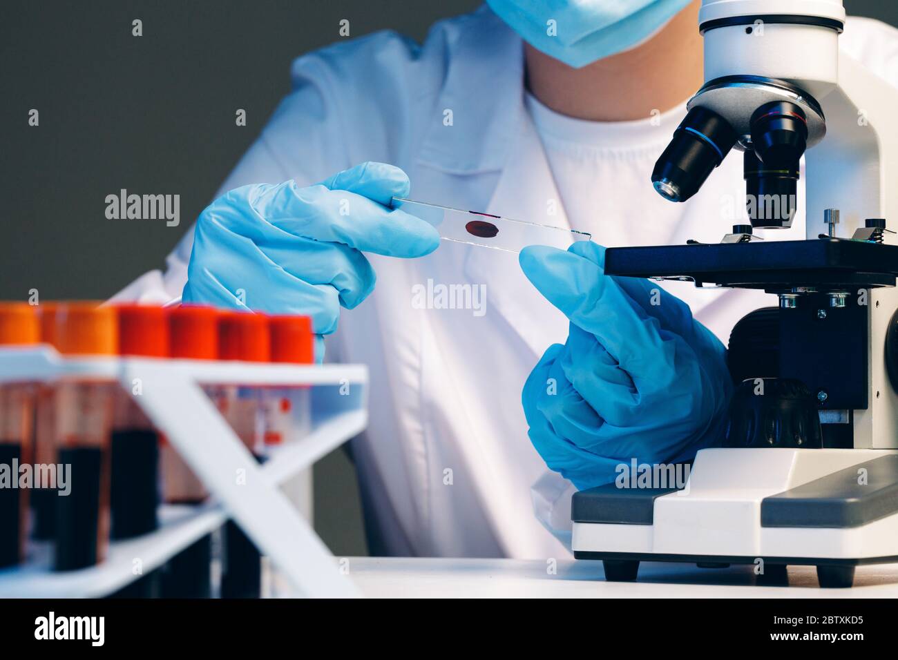 Hands of a laboratory worker doing blood test Stock Photo - Alamy