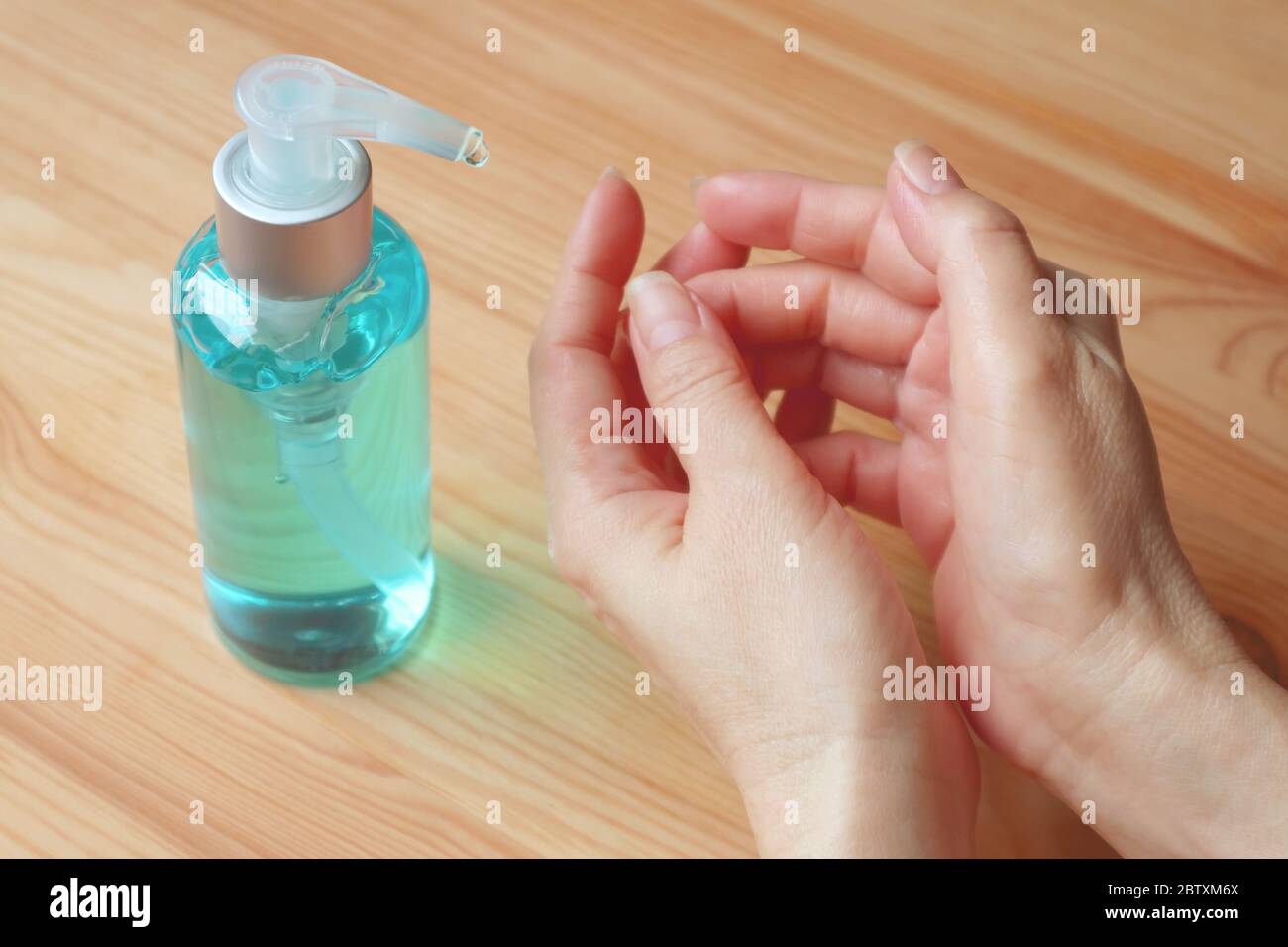 Rubbing Hands with Alcohol Cleansing Gel to Prevent the Infection Stock ...