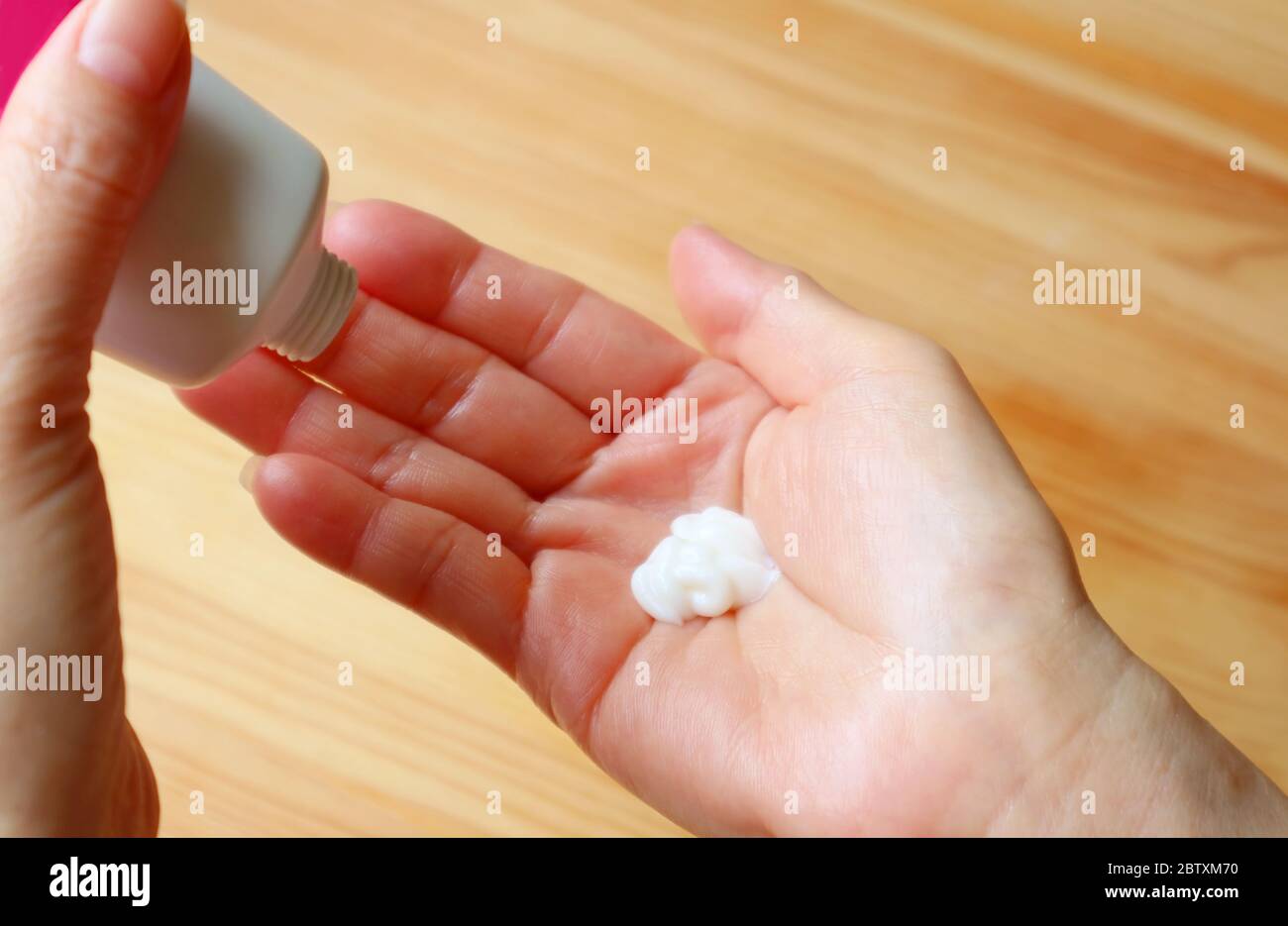 Hand moisturizing hi-res stock photography and images - Alamy
