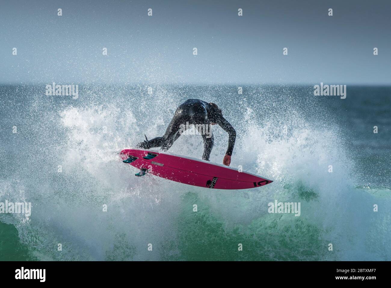 Surfer girl riding a wave hi-res stock photography and images - Alamy