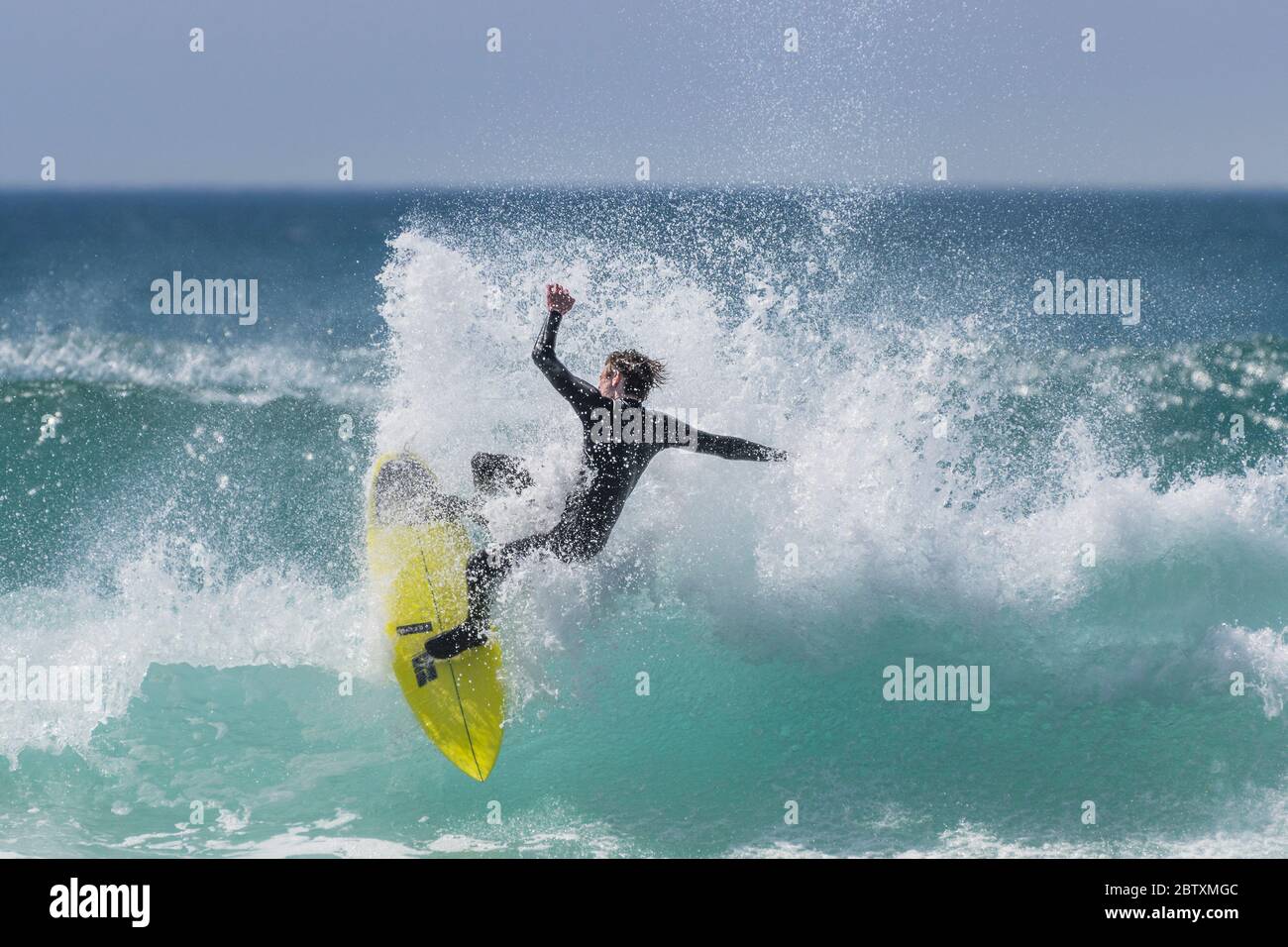 Spectacular surfing action as a surfer rides a wave at Fistral in ...