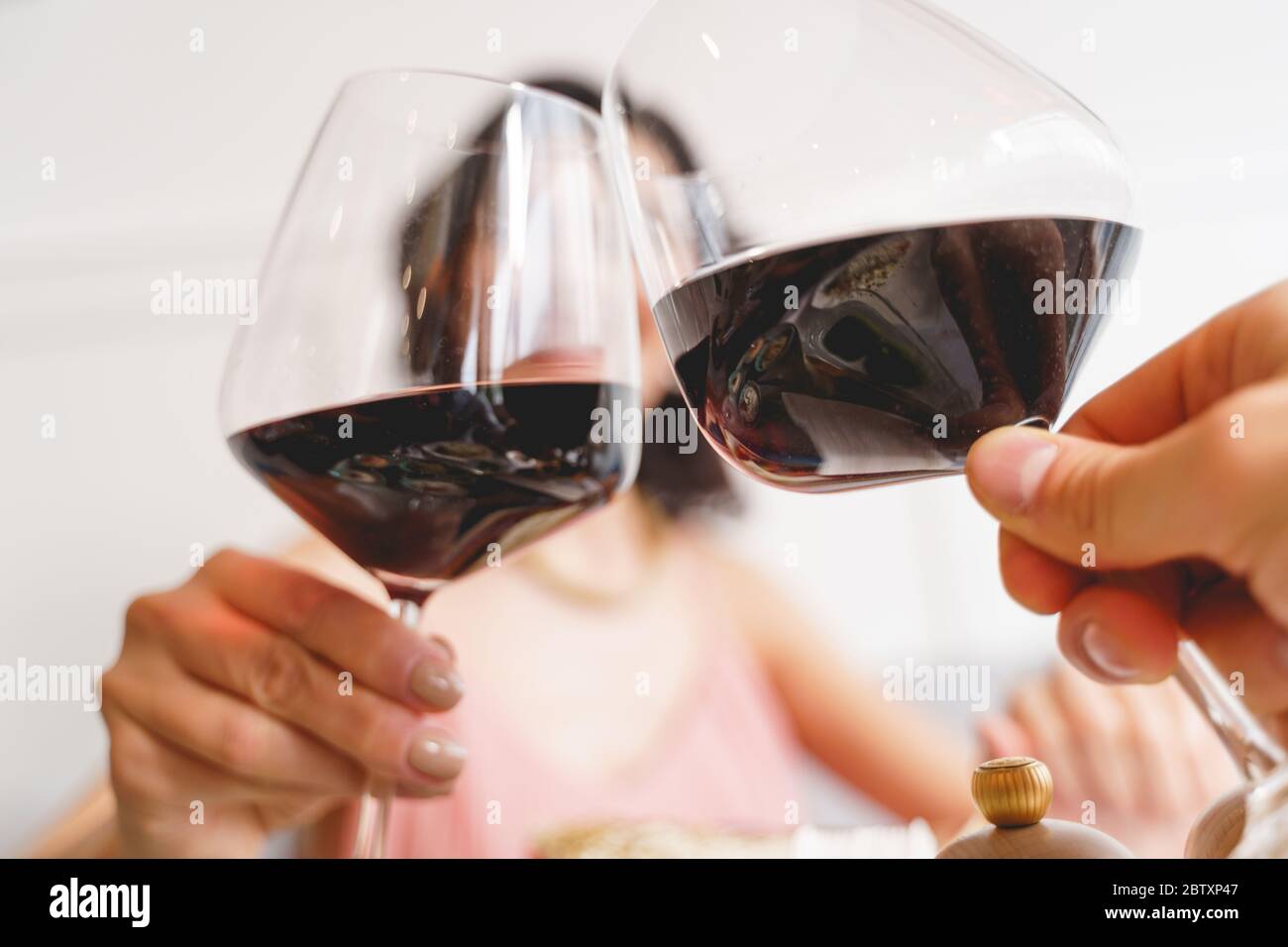 Male and female hands toasting with wine Stock Photo - Alamy