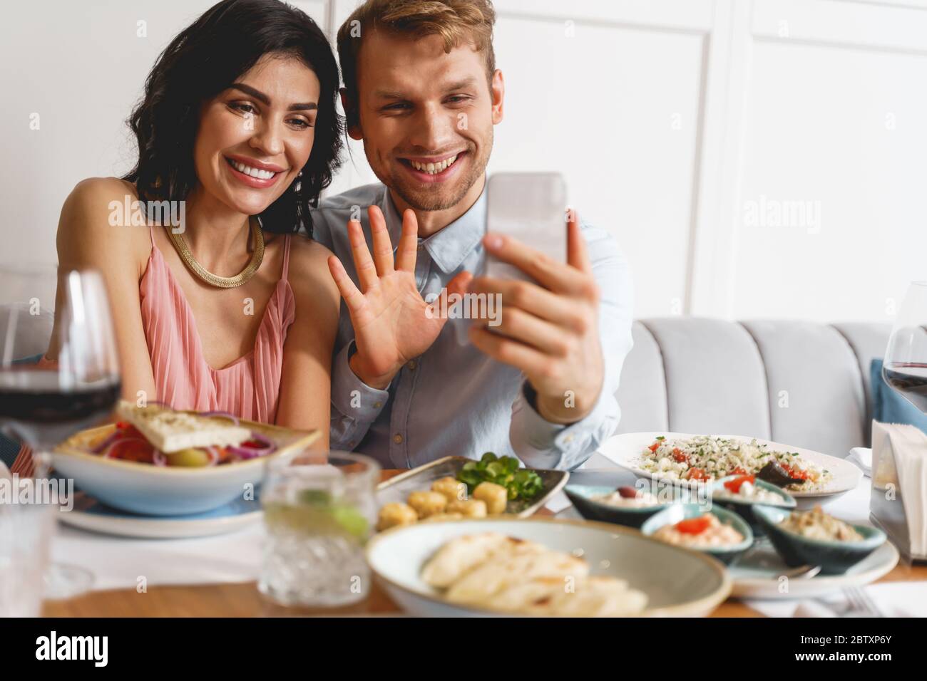 Video call wave couple hi-res stock photography and images - Alamy