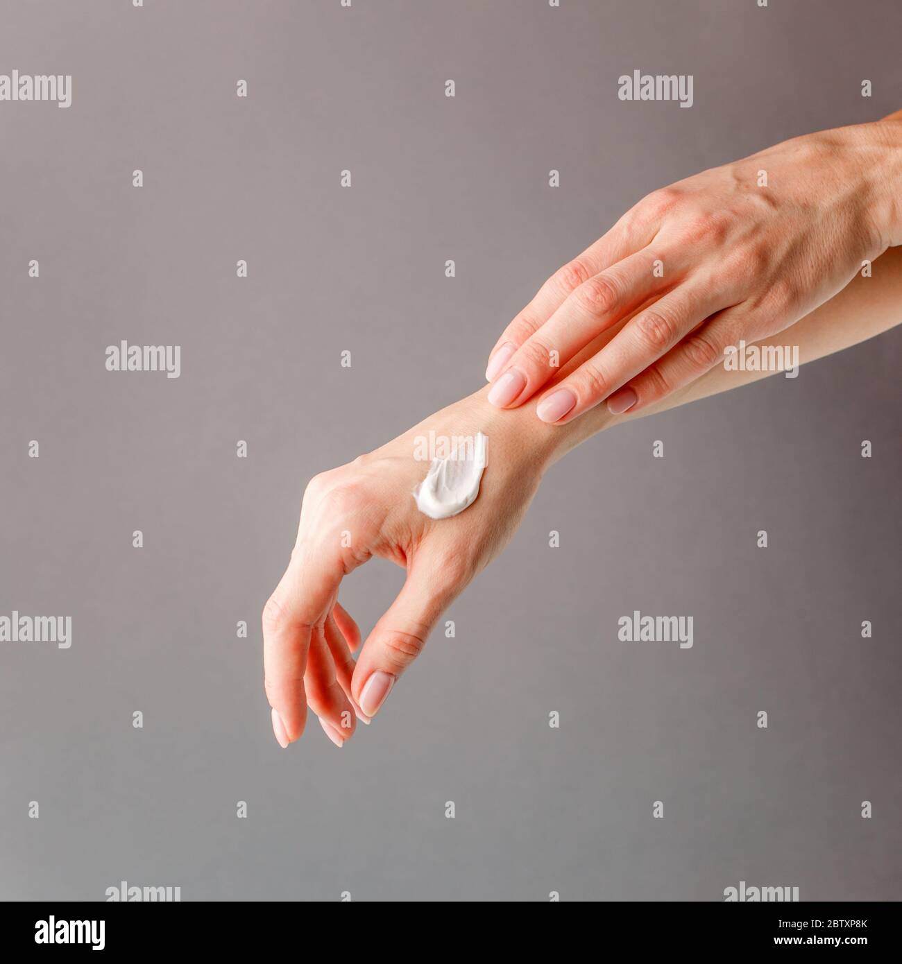 Finger applying moisturizing cream hand hi-res stock photography and ...