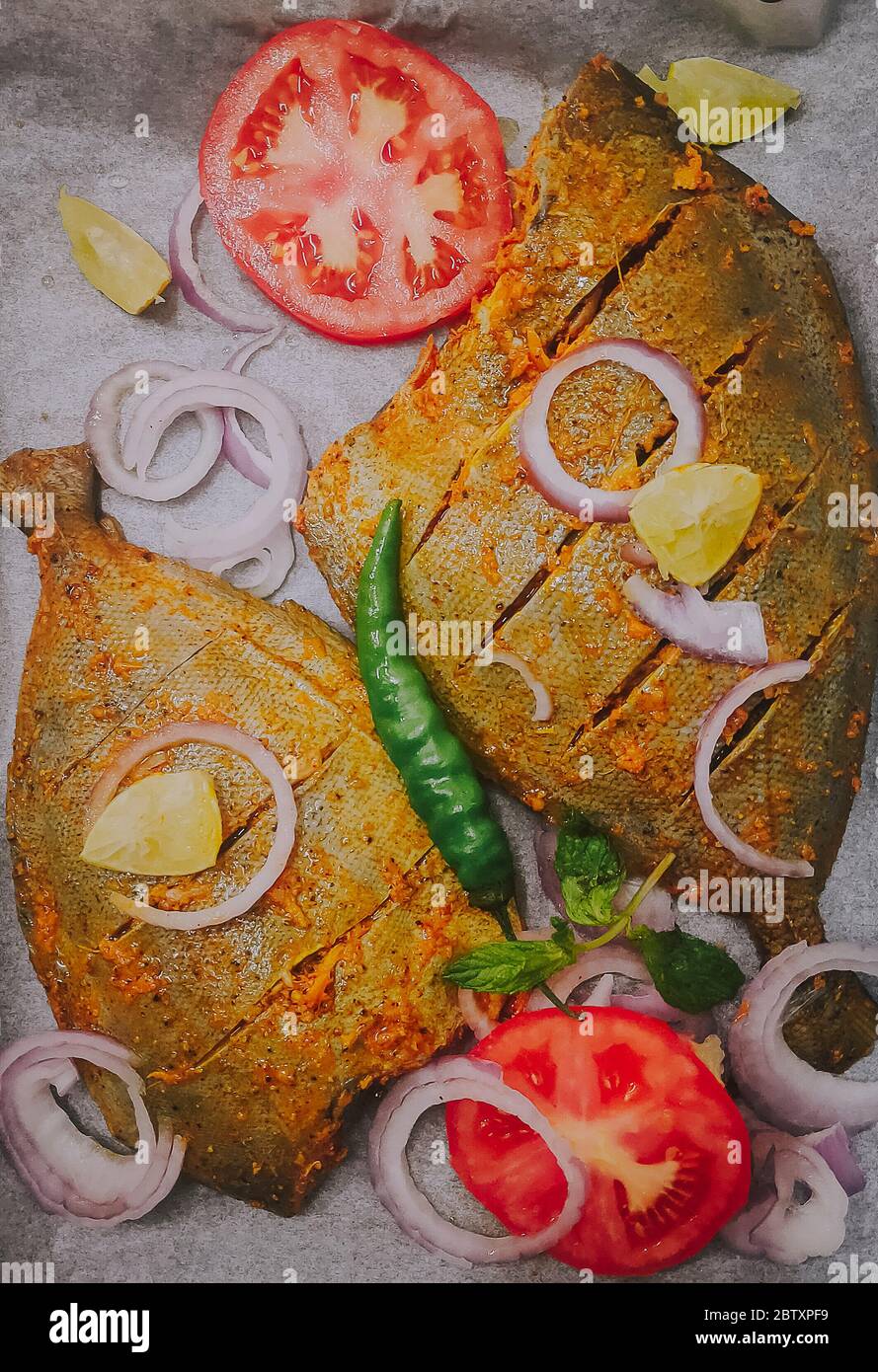 Black Pomfret with indian masala ready grill Stock Photo - Alamy