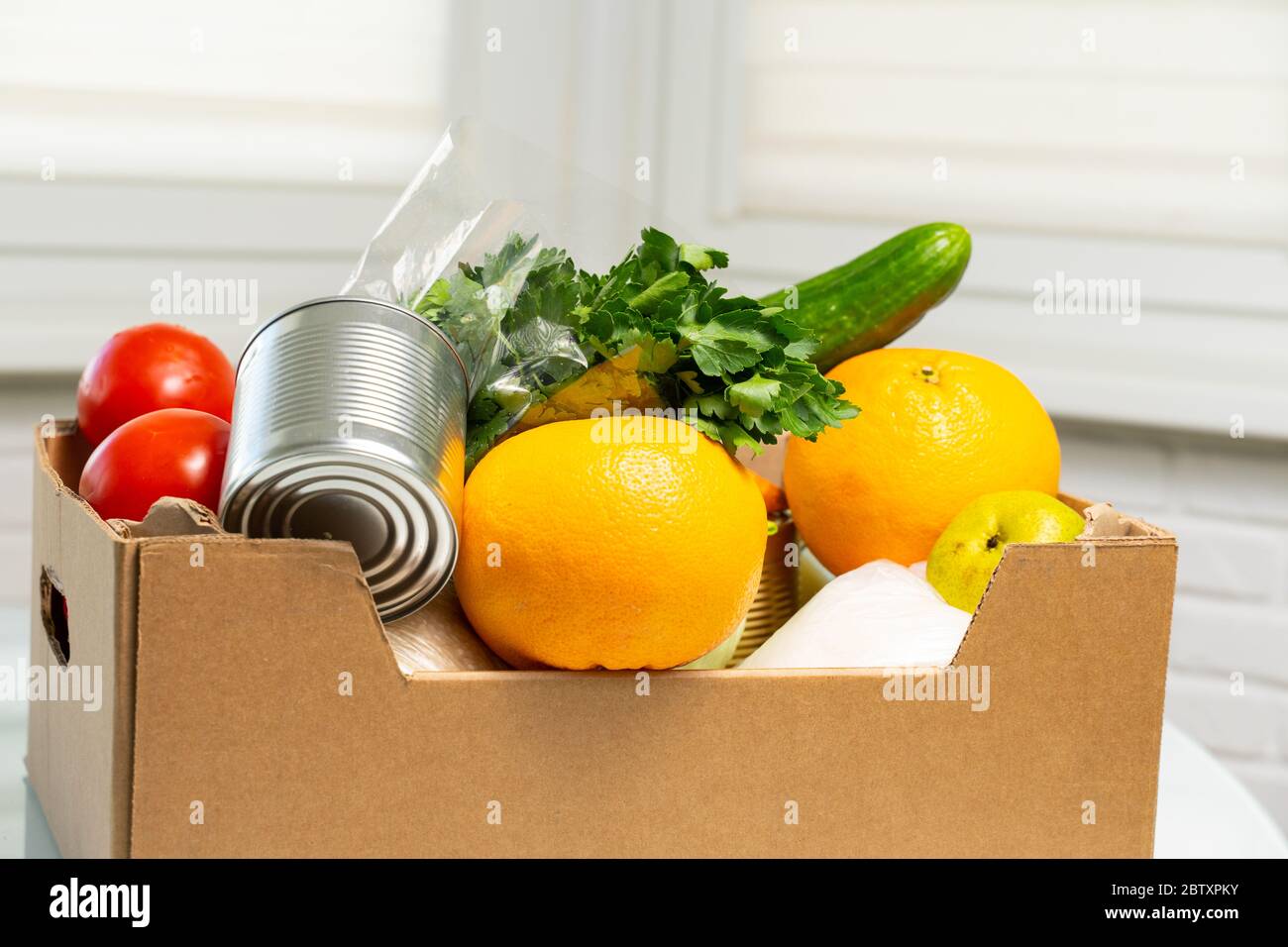 Children canned goods donation box hi-res stock photography and images ...