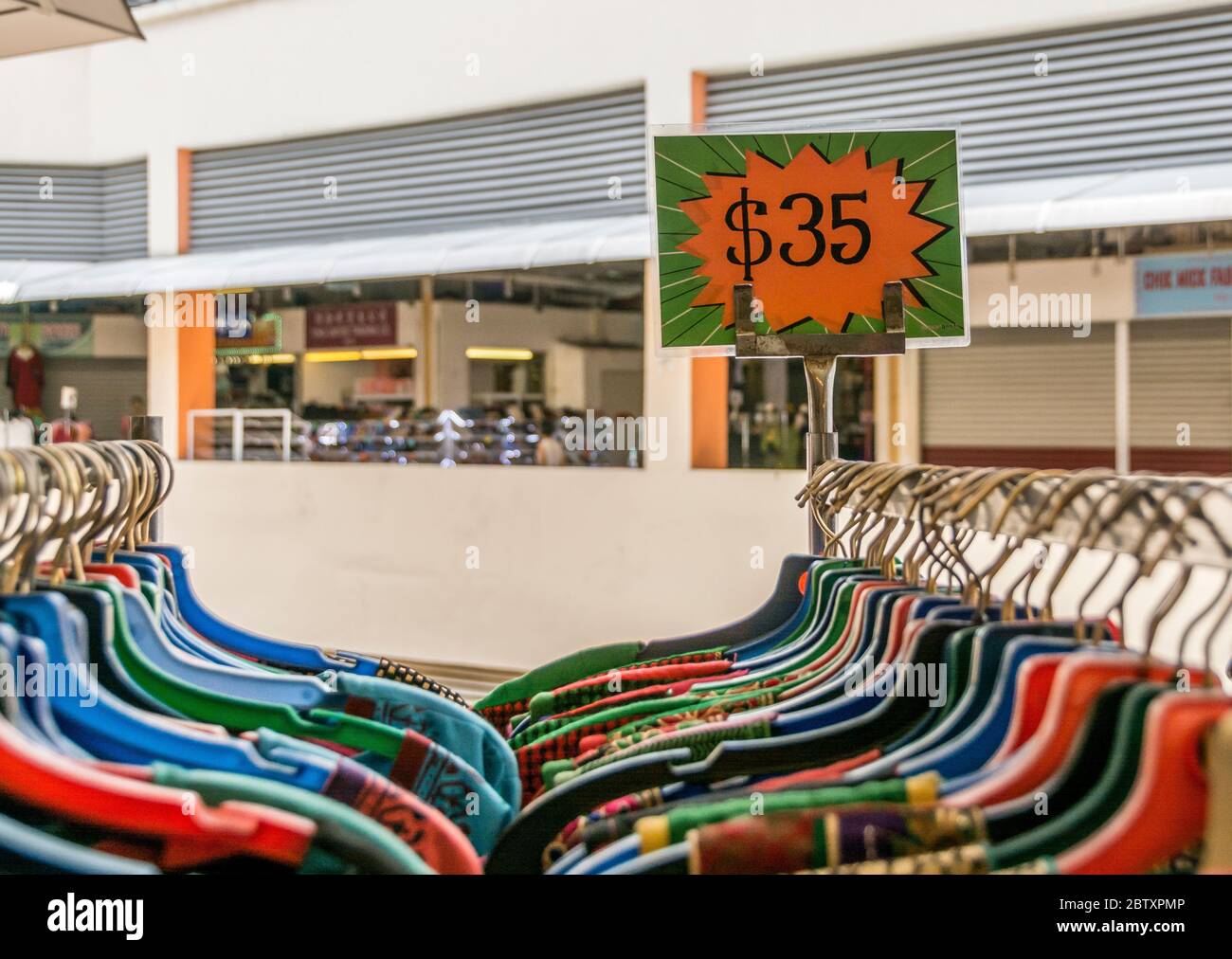 Coat hanger sign hi-res stock photography and images - Alamy