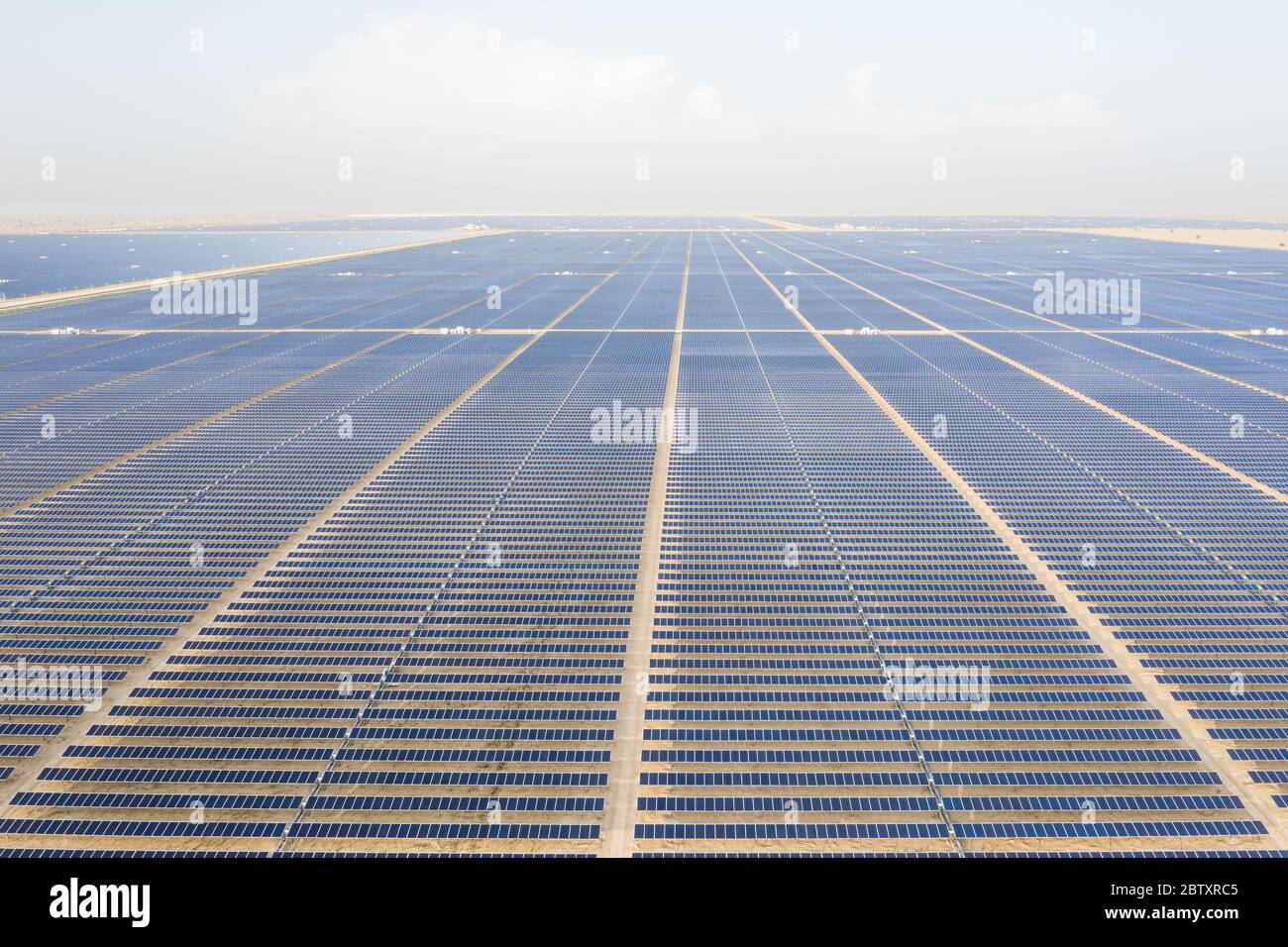 Aerial view of a landscape with photovoltaic solar panel farm producing ...