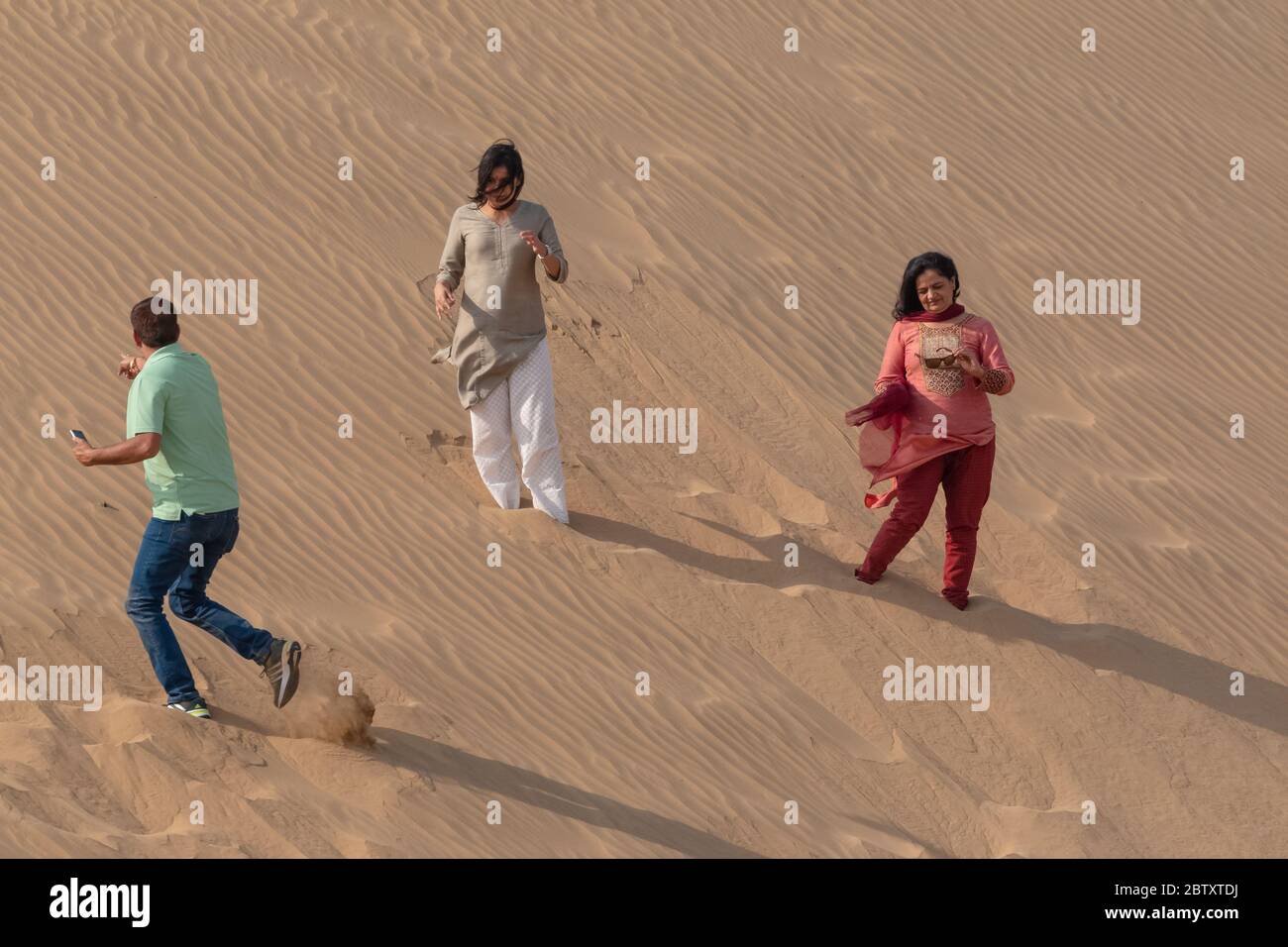 A Indian family enjoying their vacation on Thar desert of Jaisalmer ...