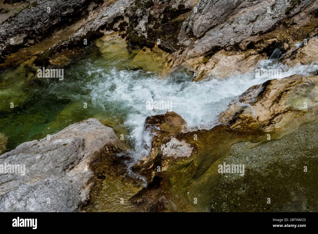Clear Mountain River Flows Over Dam Between Rocks Stock Photo - Alamy