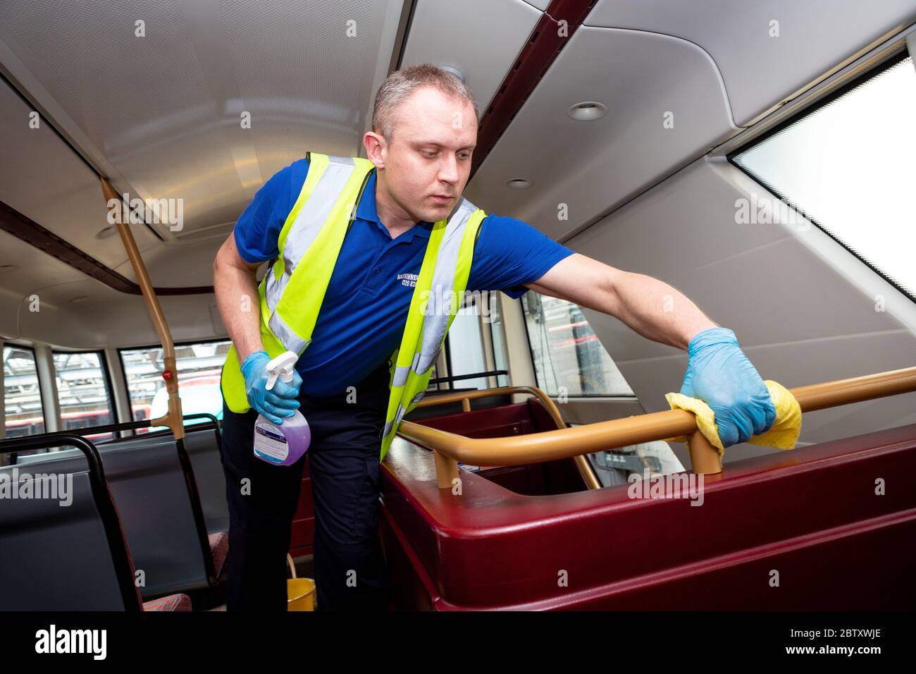 A bus is given a daily cleaning by a cleaner at Camberwell bus garage ...