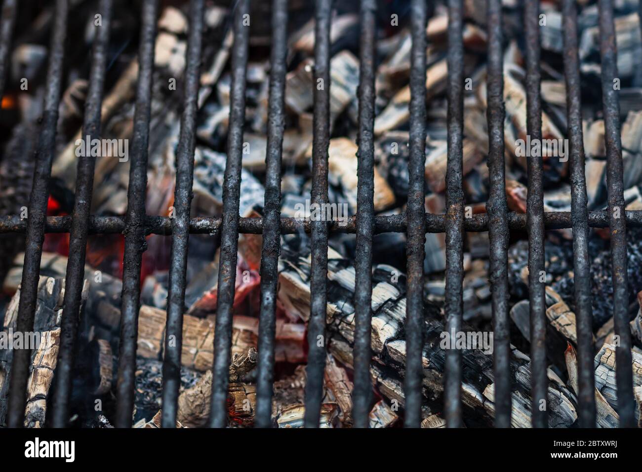 Empty flaming charcoal grill with open fire, ready for steak ...