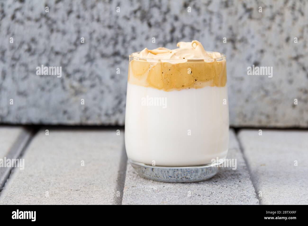 Dalgona coffee on grey concrete background. Free copy space Stock Photo ...