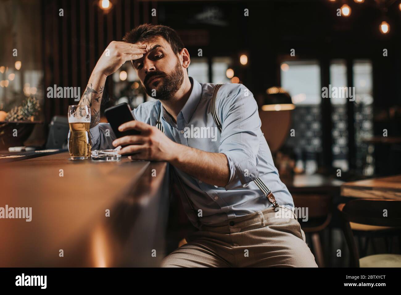 Handsome guy smoking cigar bar hi-res stock photography and images - Alamy