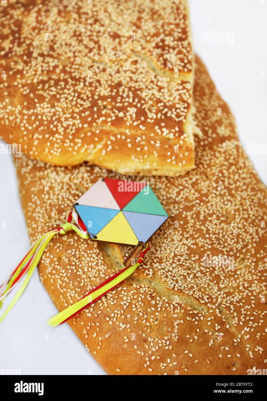 traditional Clean Monday food - greek bread lagana with decorative kite ...