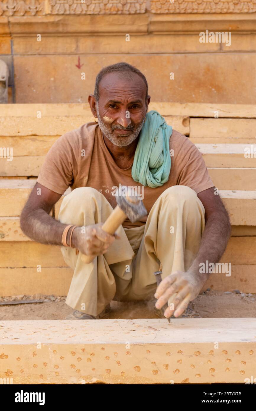 Men at work, Artist working on the stone Stock Photo - Alamy