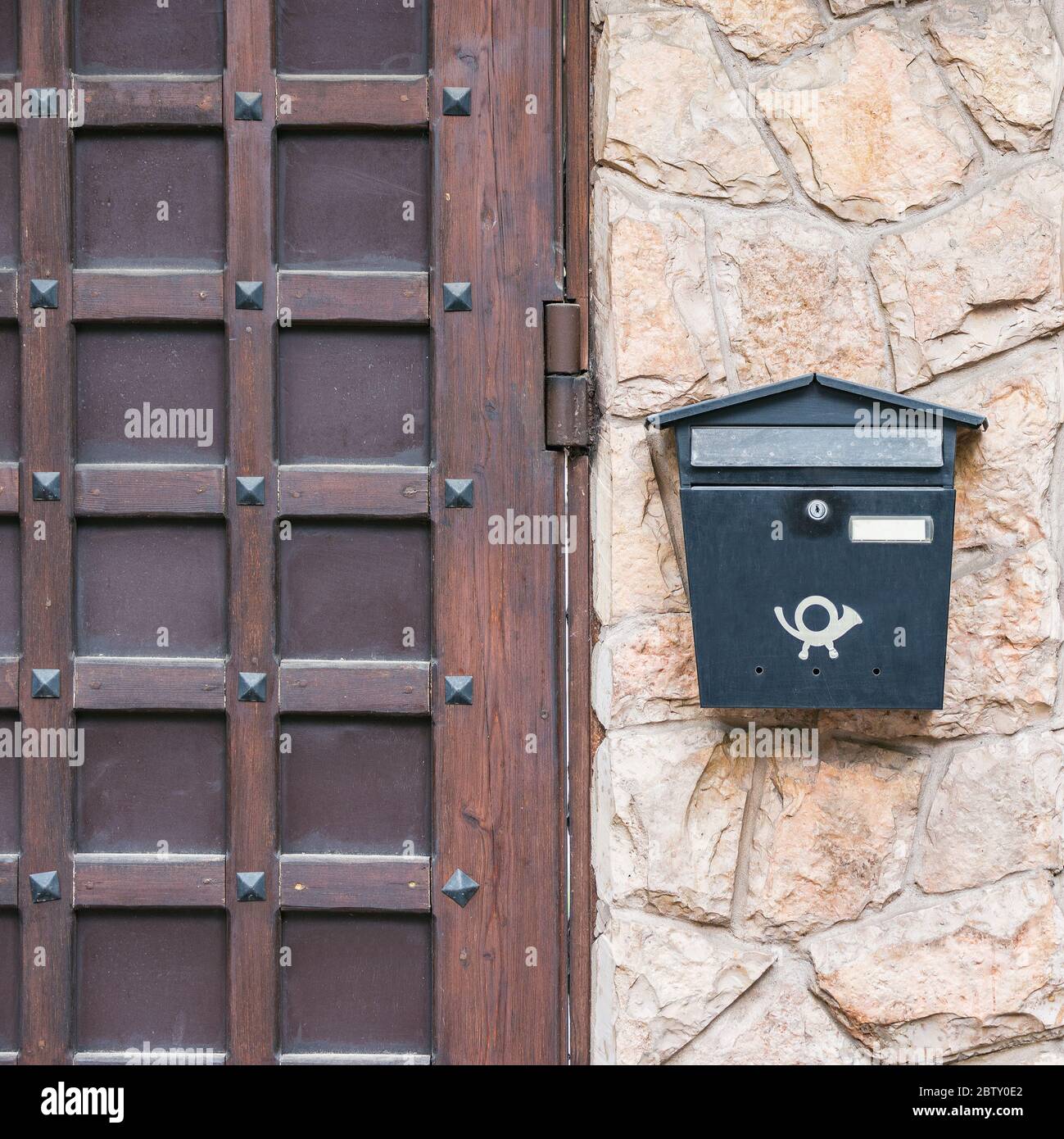 Mail box on the stone fence Stock Photo - Alamy