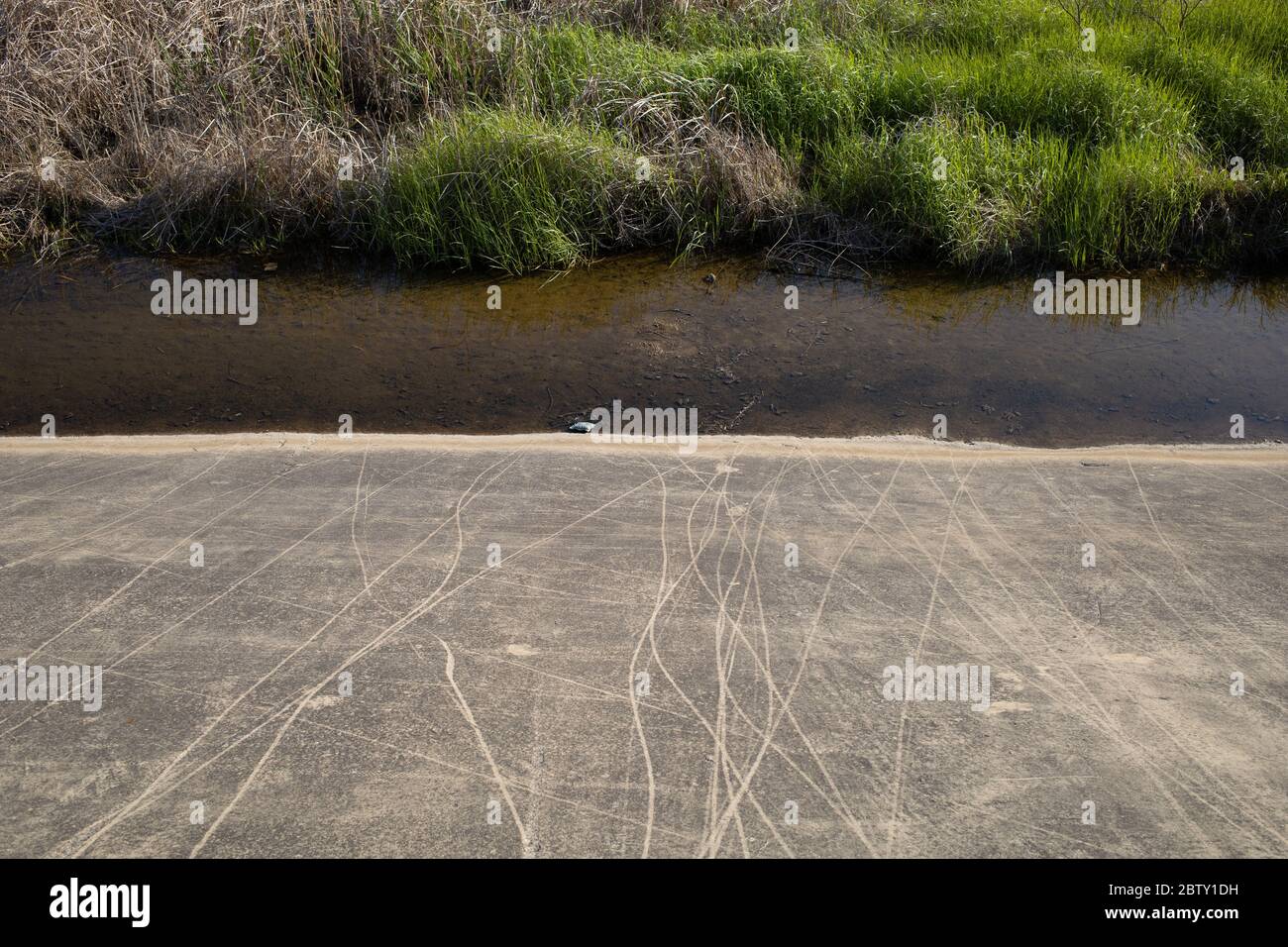 concrete embankment and surrounding meadow Stock Photo - Alamy