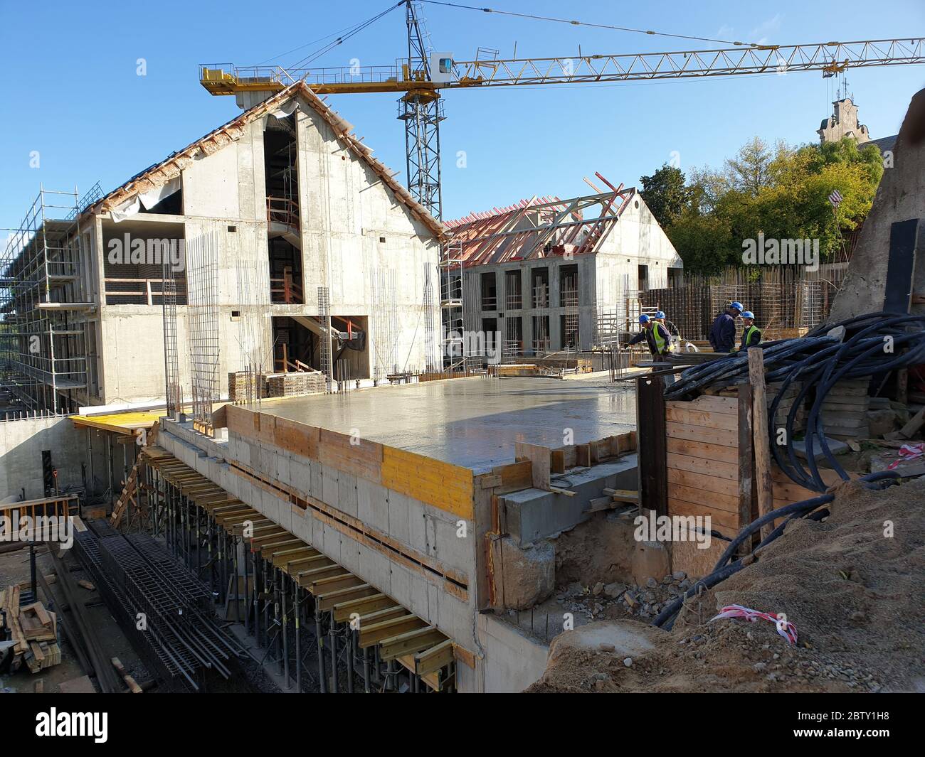 Workers are pouring new concrete layer in construction site Stock Photo ...