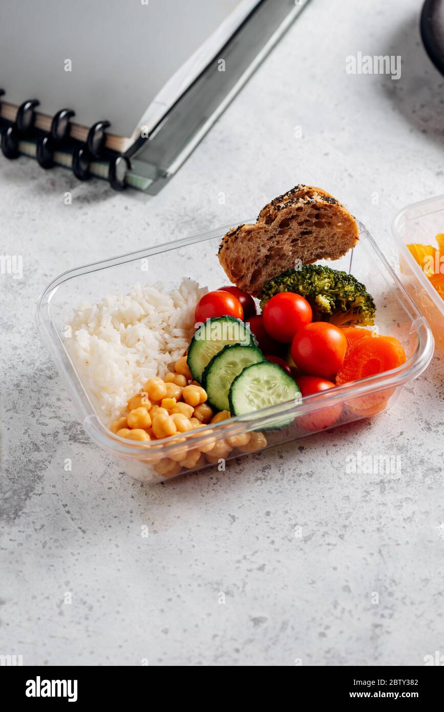Healthy food in lunch box, on working table with working elements Stock ...