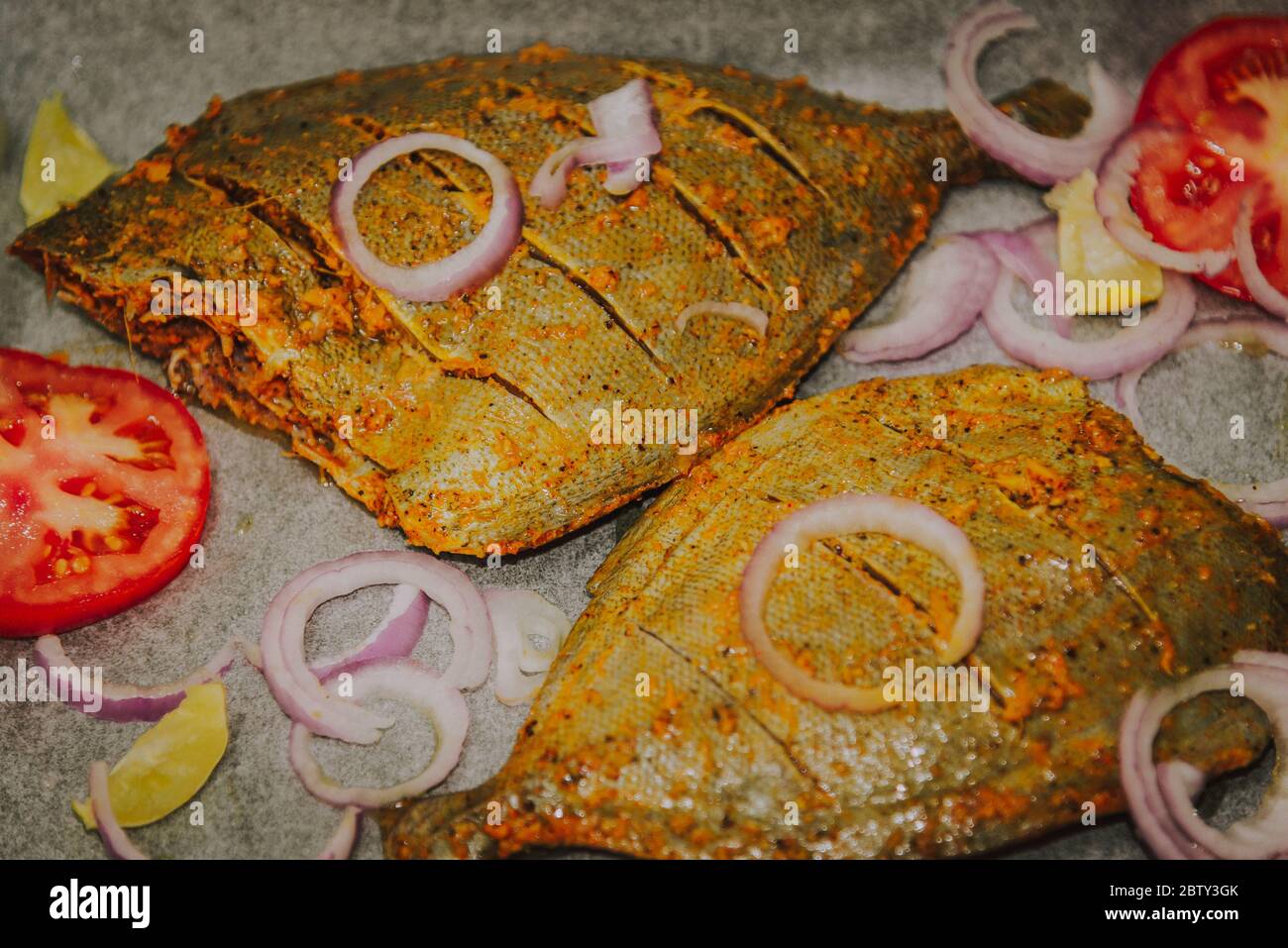 Black Pomfret with indian masala ready grill Stock Photo - Alamy
