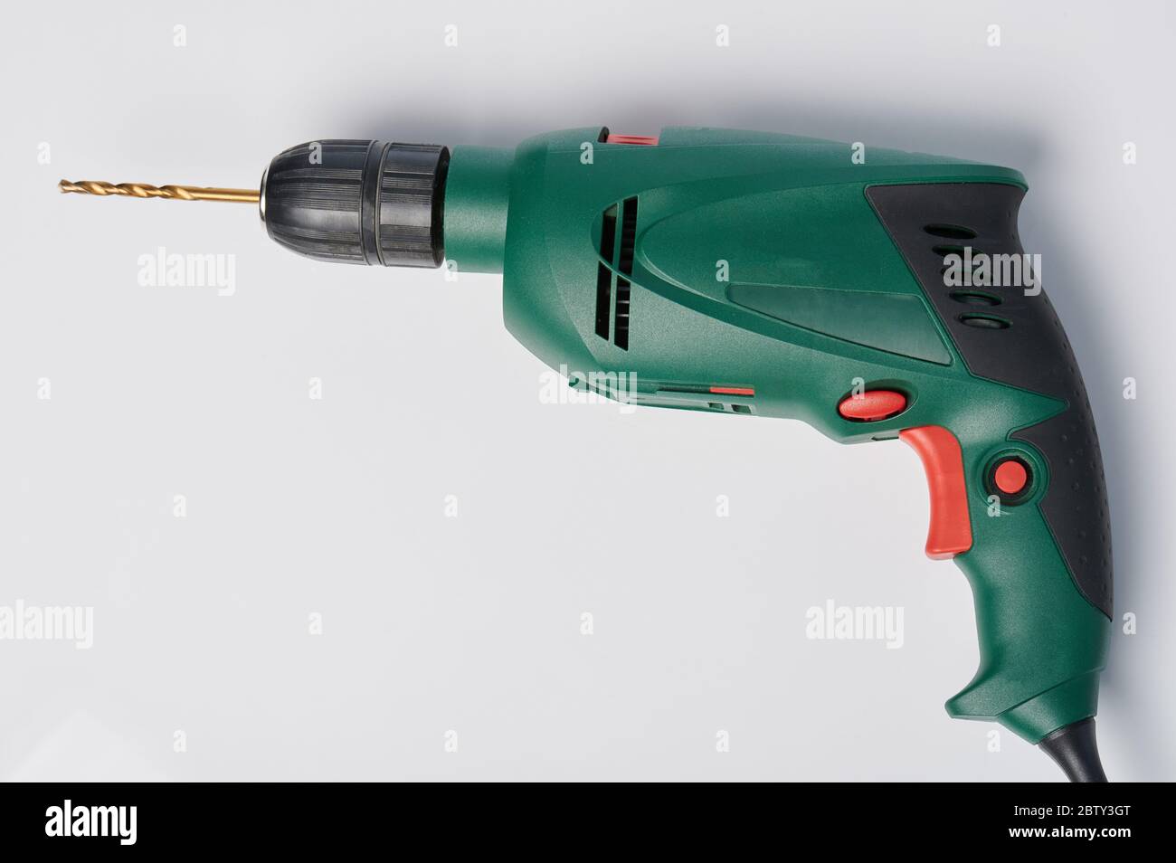 Green drill tool isolated on white studio background Stock Photo - Alamy