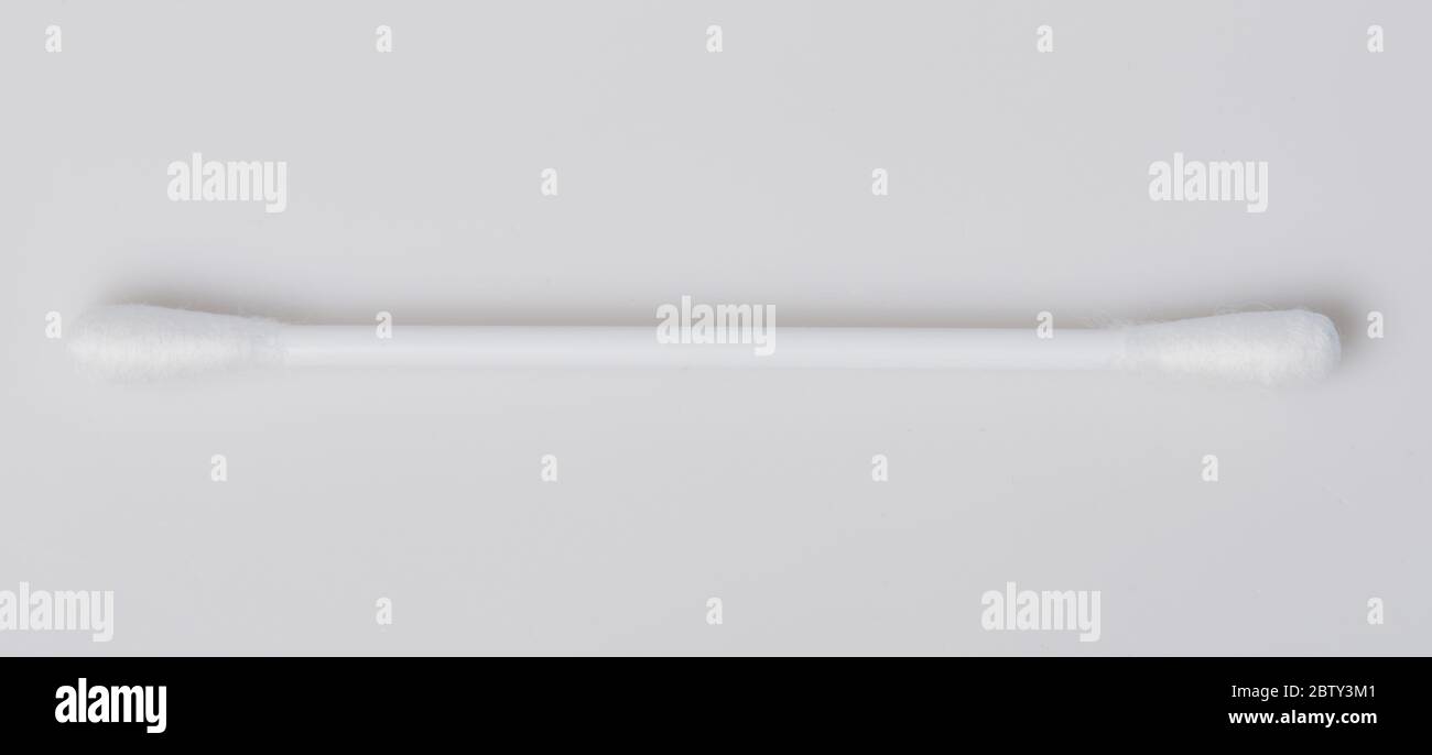 One white cotton swab isolated clsoe up view Stock Photo - Alamy