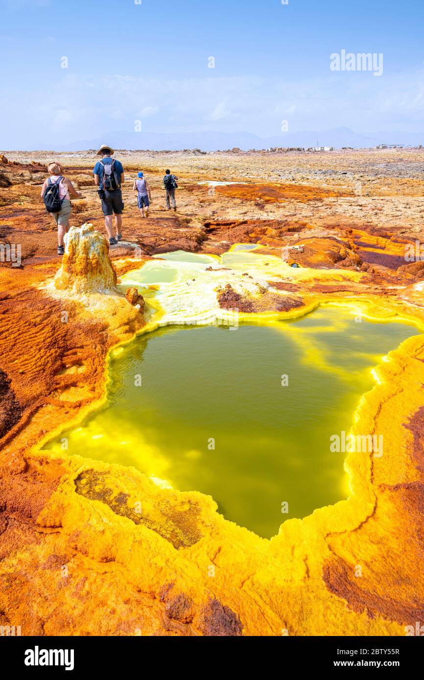 Tourists looking at hot springs and sulphur ponds, Dallol, Danakil ...