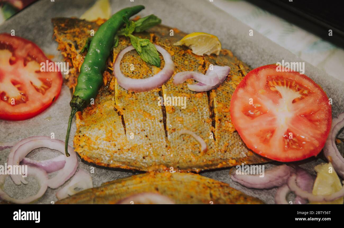 Black Pomfret with indian masala ready grill Stock Photo - Alamy
