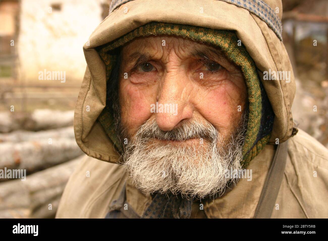 Portrait of elderly man living in poverty in Romania's countryside ...