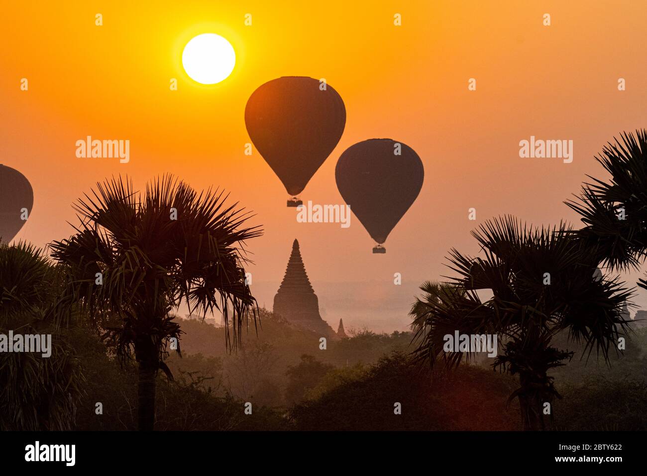 Hot air balloons over Bagan at sunrise, Bagan (Pagan), Myanmar (Burma ...