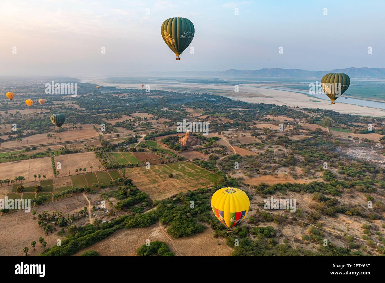 Hot air balloon at sunrise over temples of Bagan (Pagan), Myanmar ...