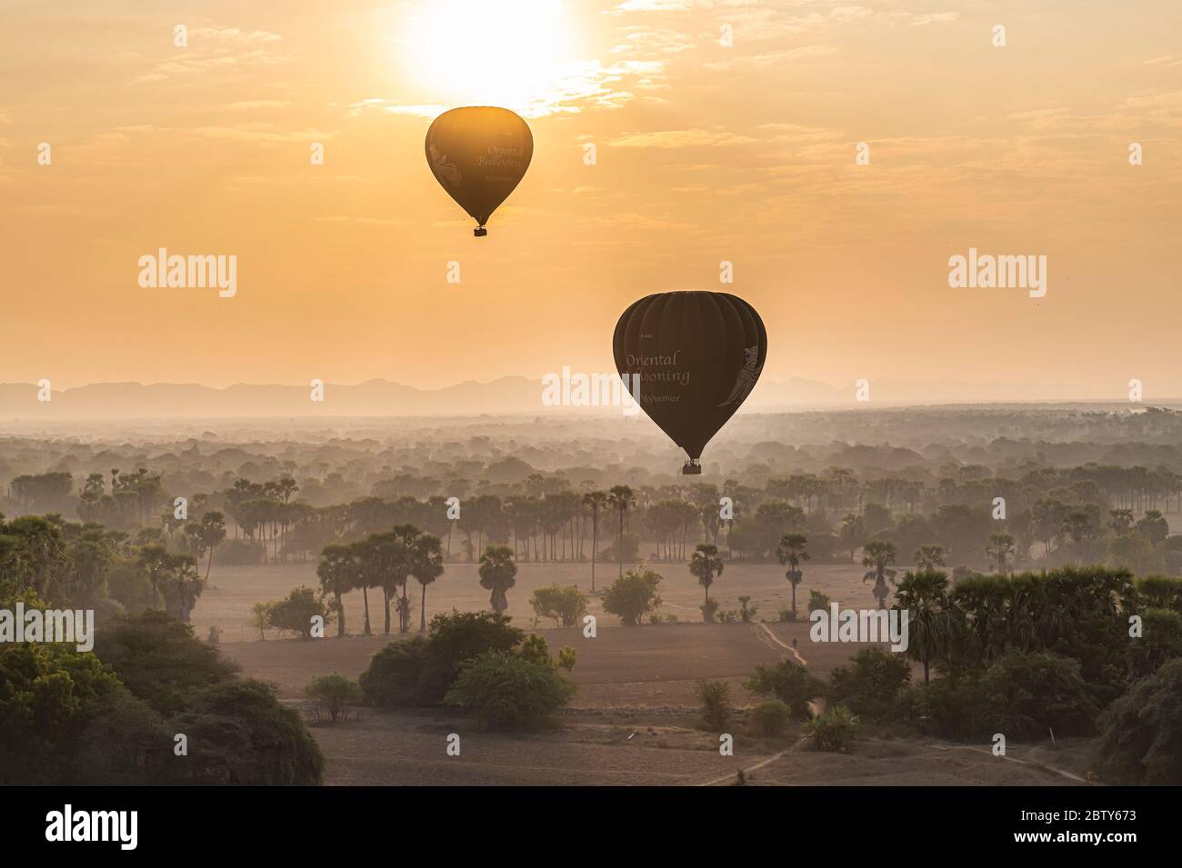 Hot air balloons at sunrise over temples of Bagan (Pagan), Myanmar ...
